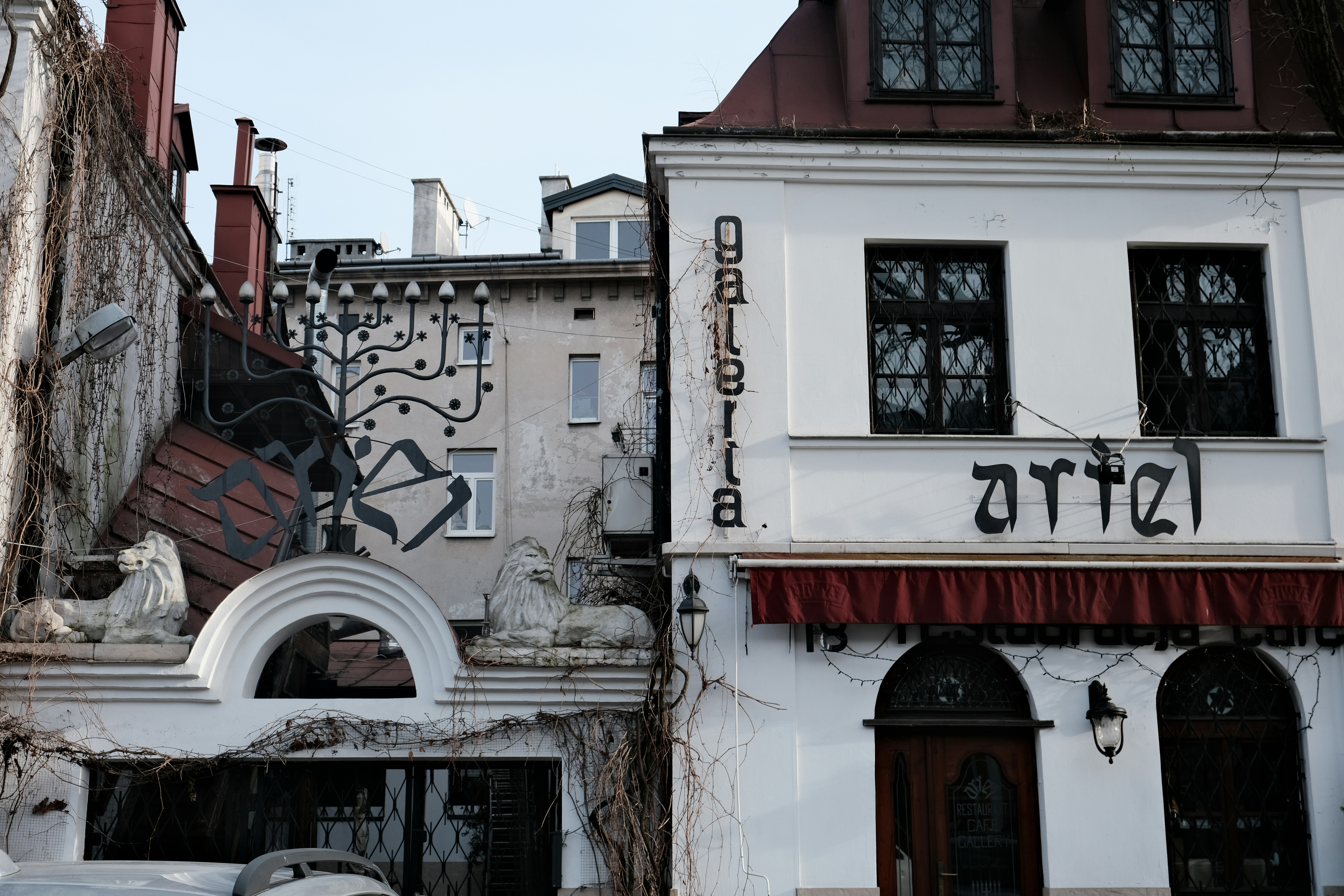 Facade of a Boutique With Decorative Arch and Signage