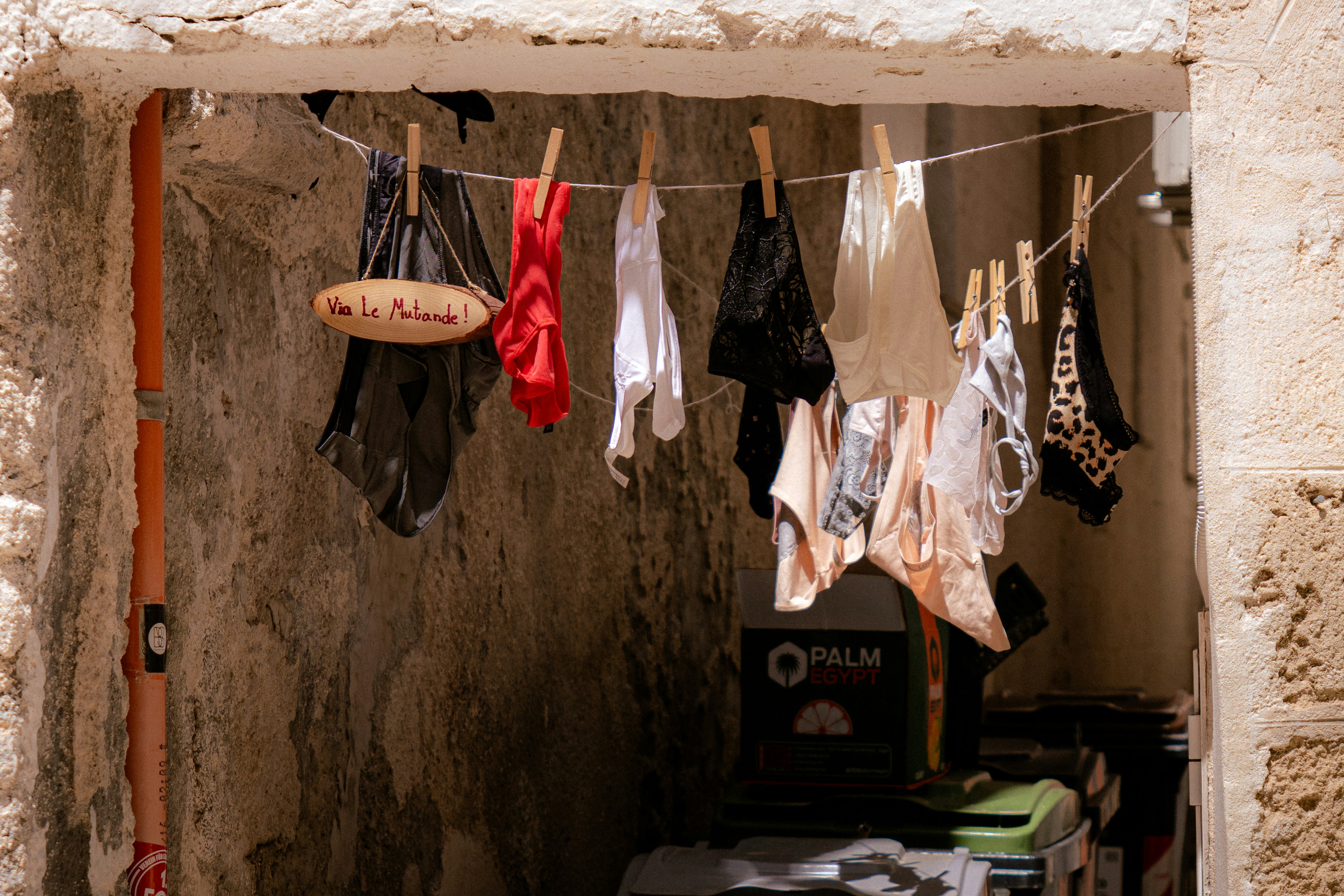 Clothesline Corridor: Laundry Crossing a Narrow Passage