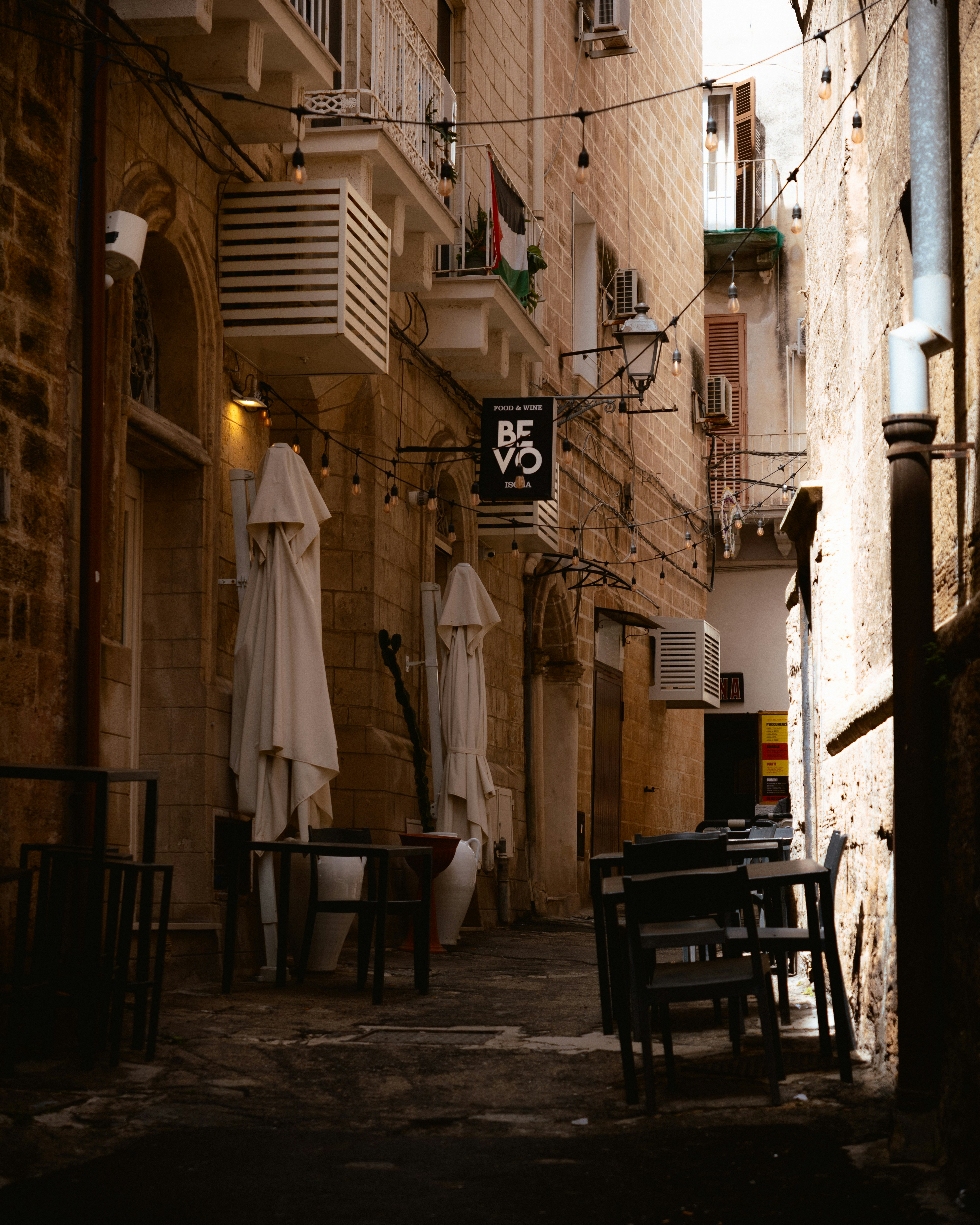 Narrow Mediterranean Lane: Quiet Occupied Courtyard</