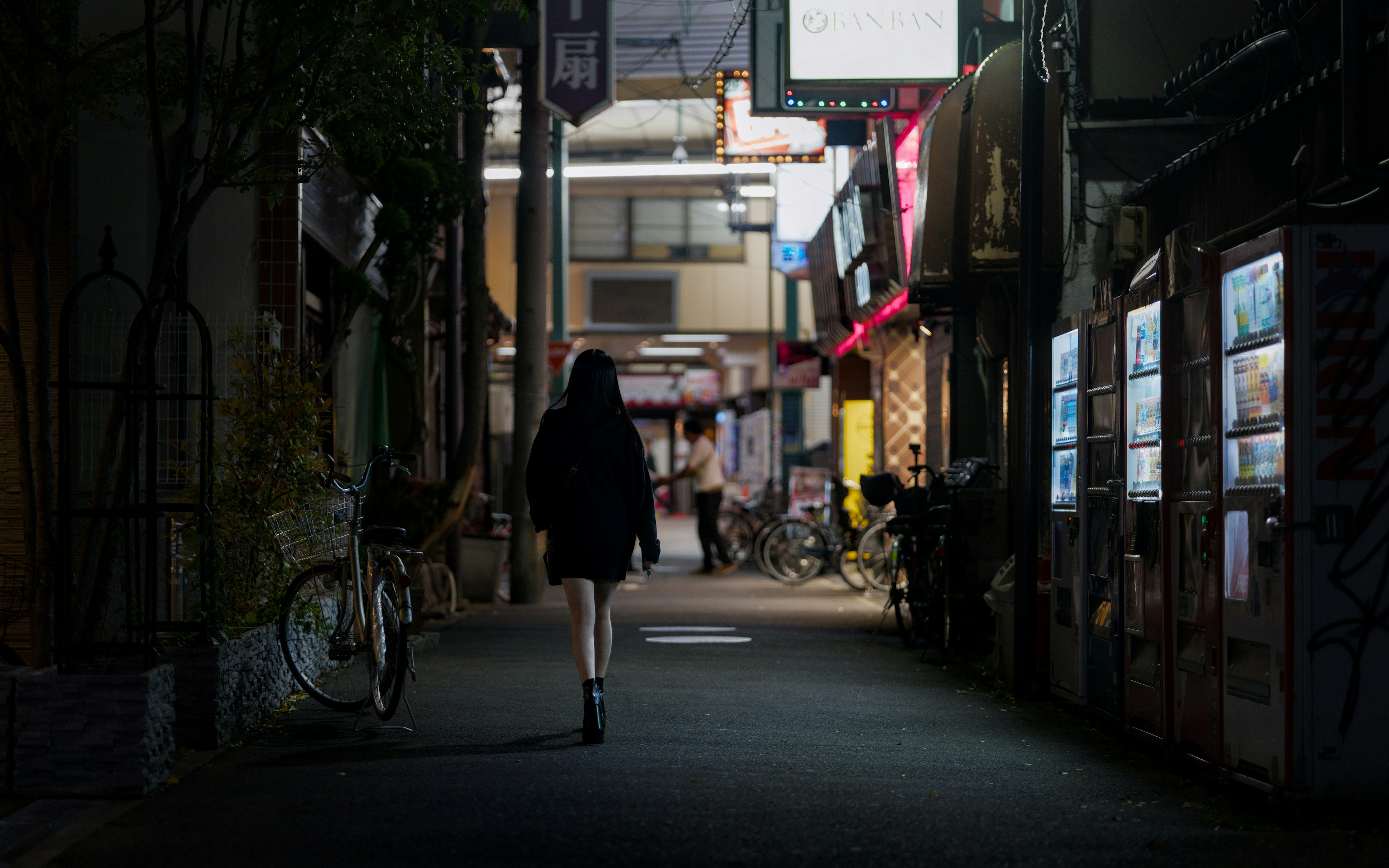 Midnight Walk Through a Neon-Arched Alley