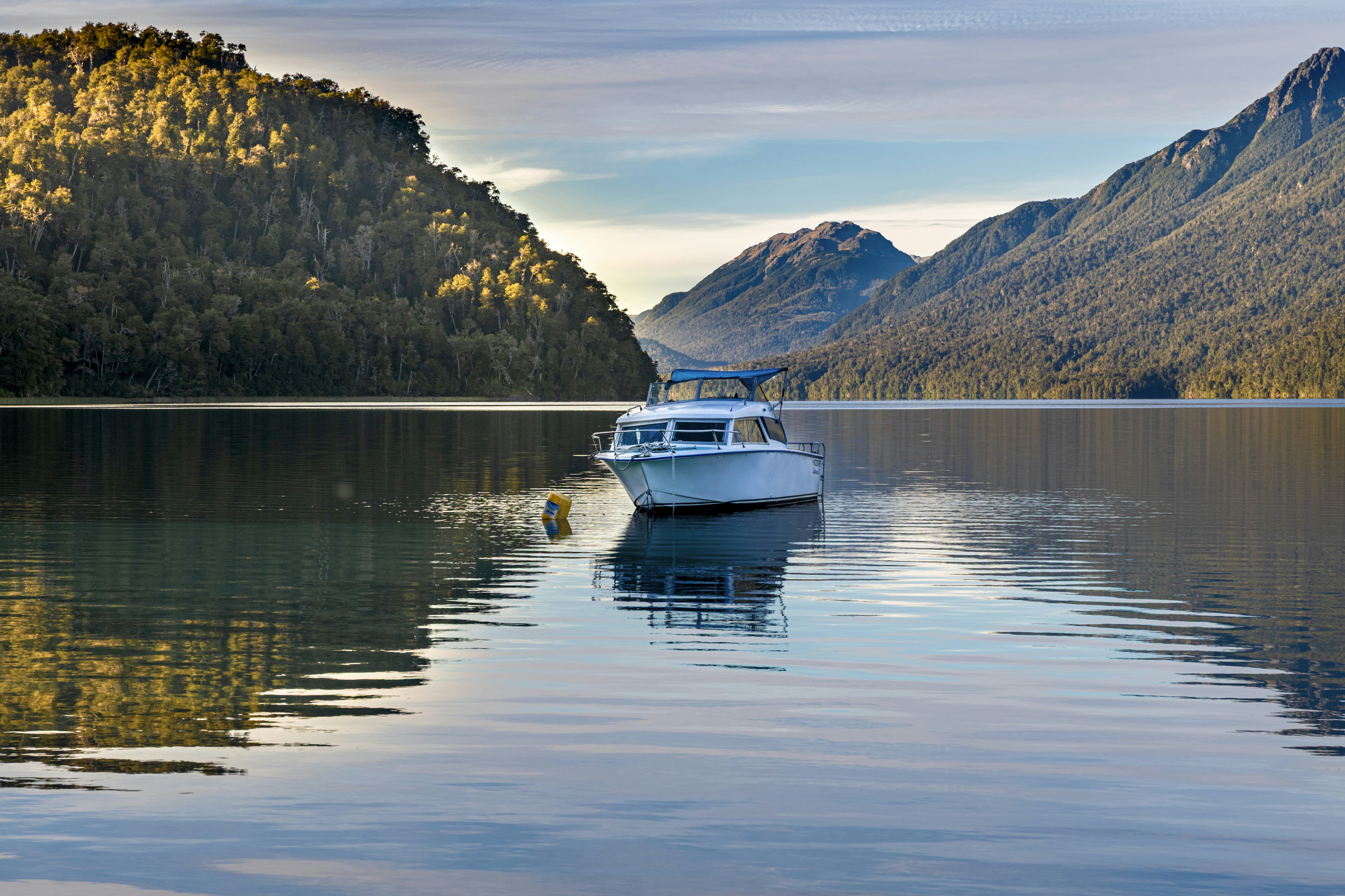 Moonlit Motorboat in a Glassy Fjord