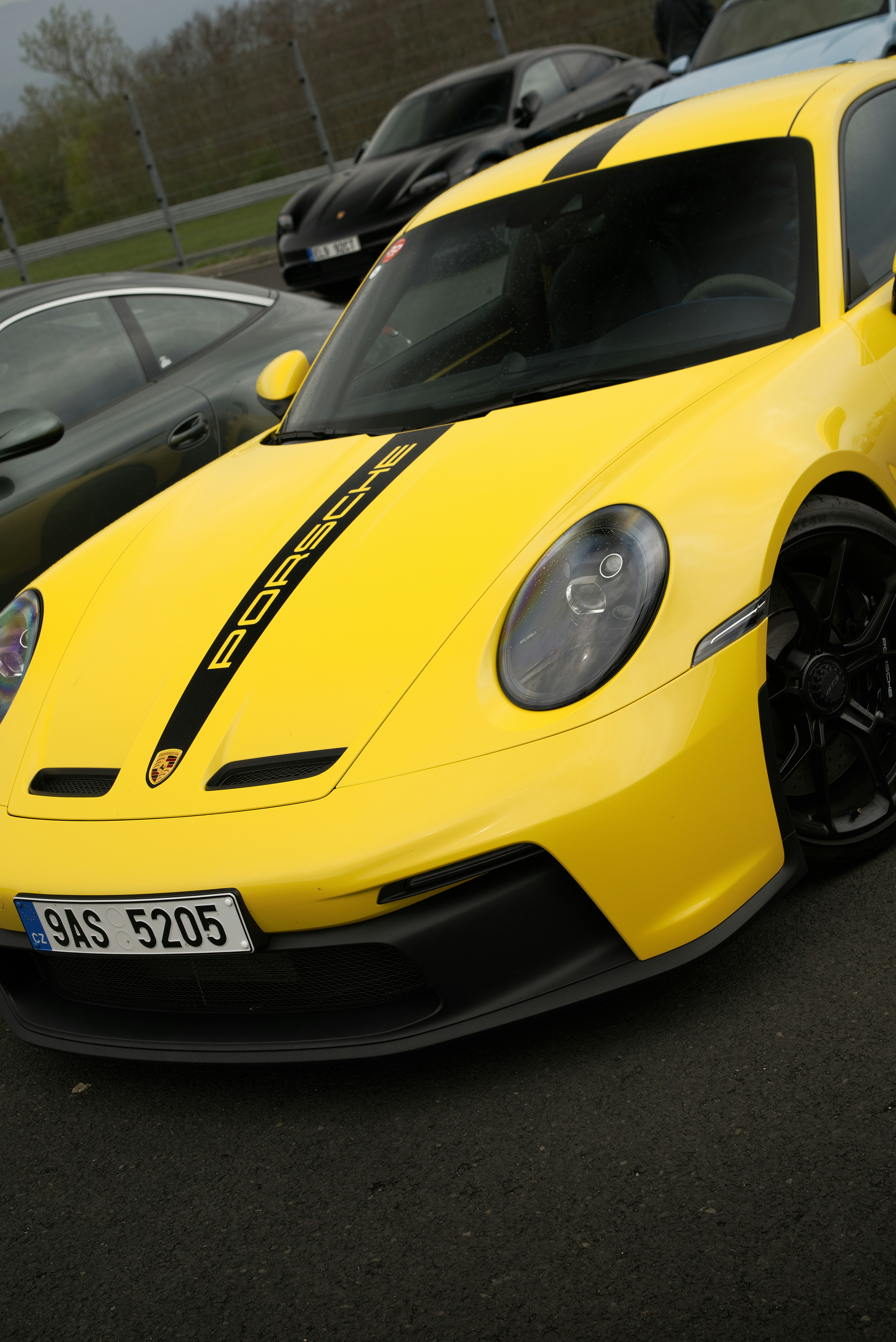Yellow Porsche Strikes a Curved Forecourt Glance