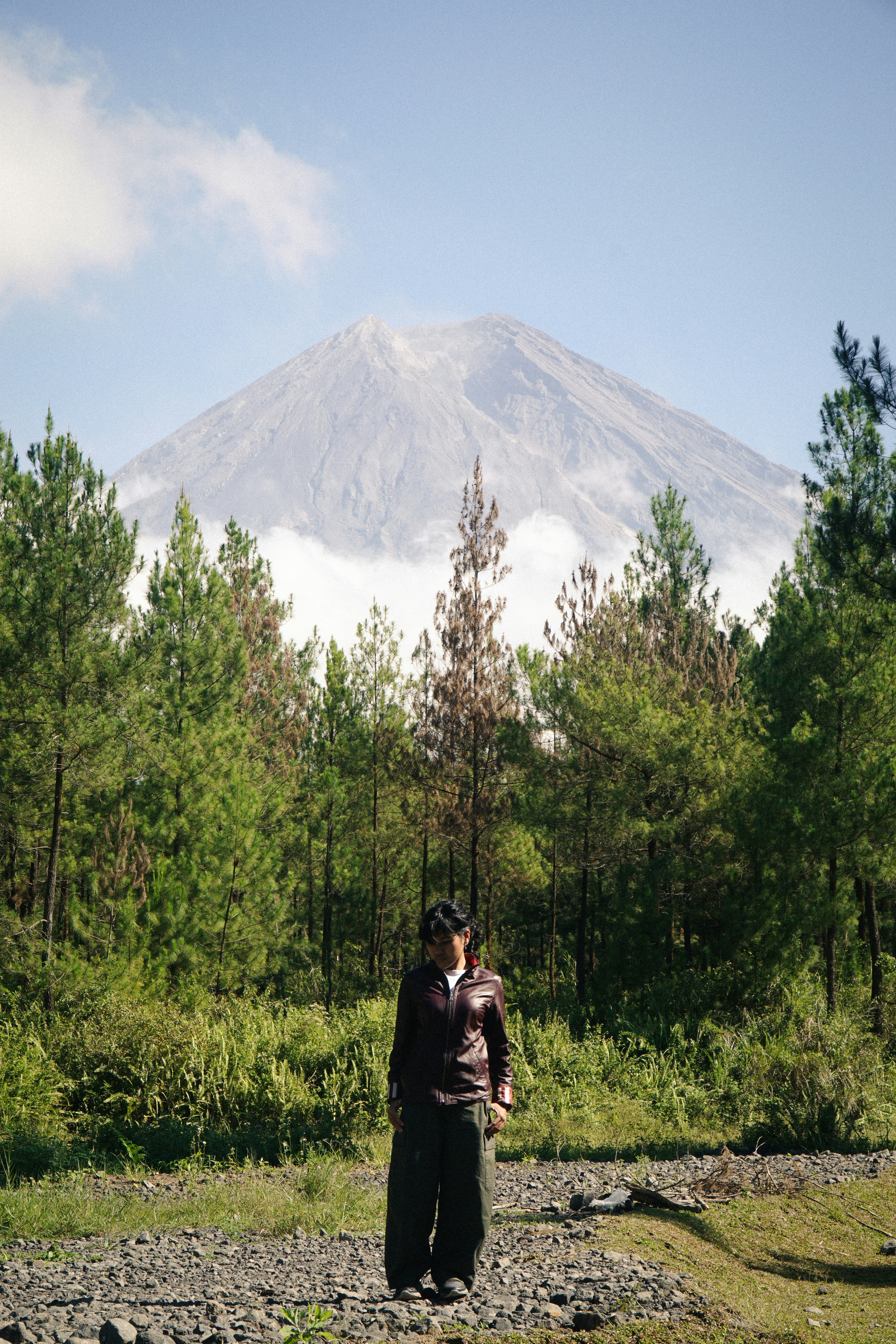 Footsteps Toward the Volcanic Peak: A Lone Traveler Beneath the Mountain