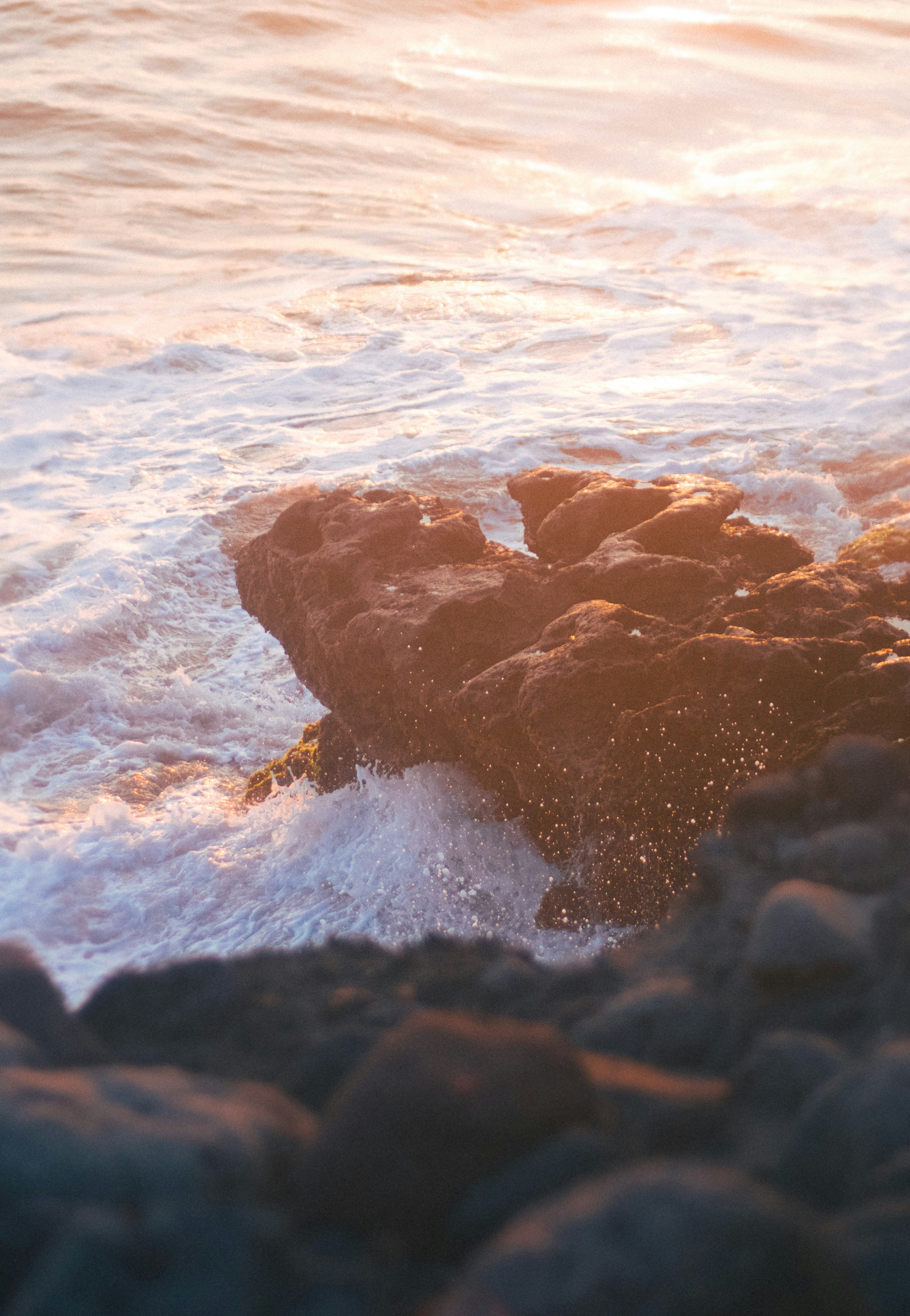 Sunlit Breaker: A Rugged Rock Corner Reclaimed by Waves