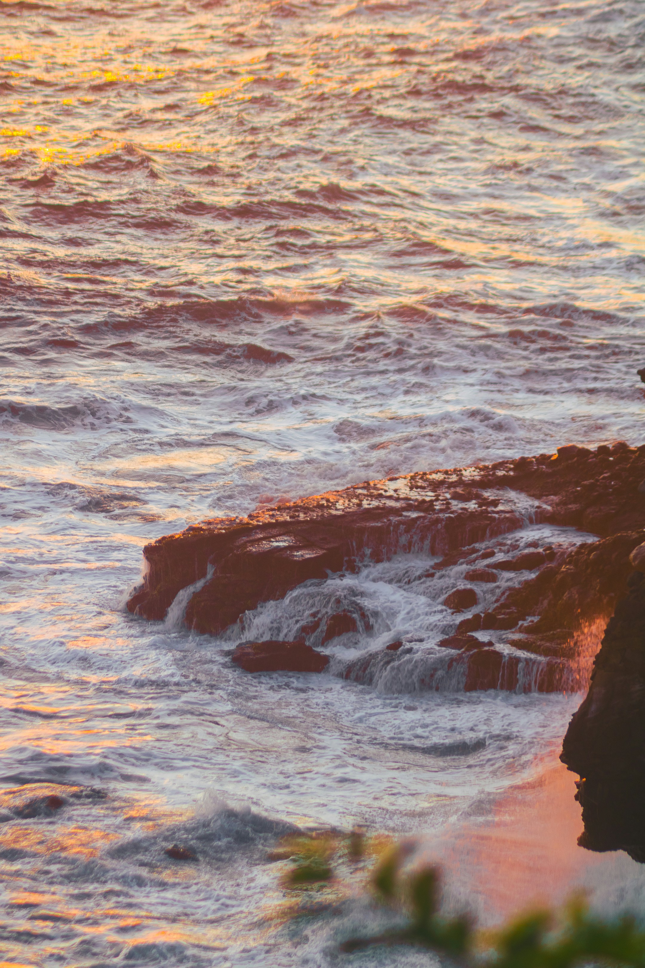 Golden Hour Cliffs and Lapping Waves