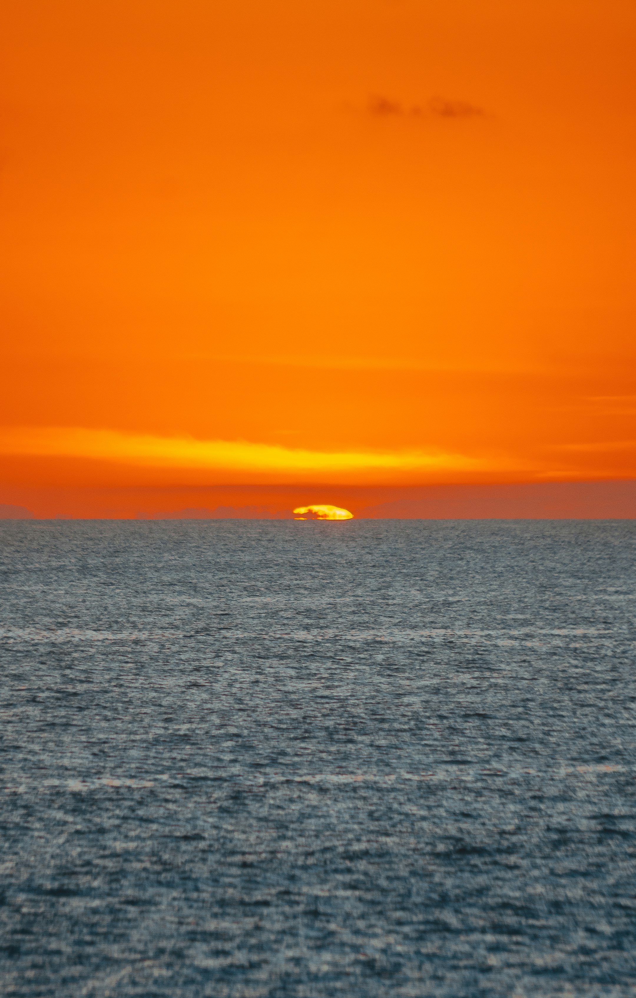 Slipstream of the Sun: Sunset over a Quiet Sea