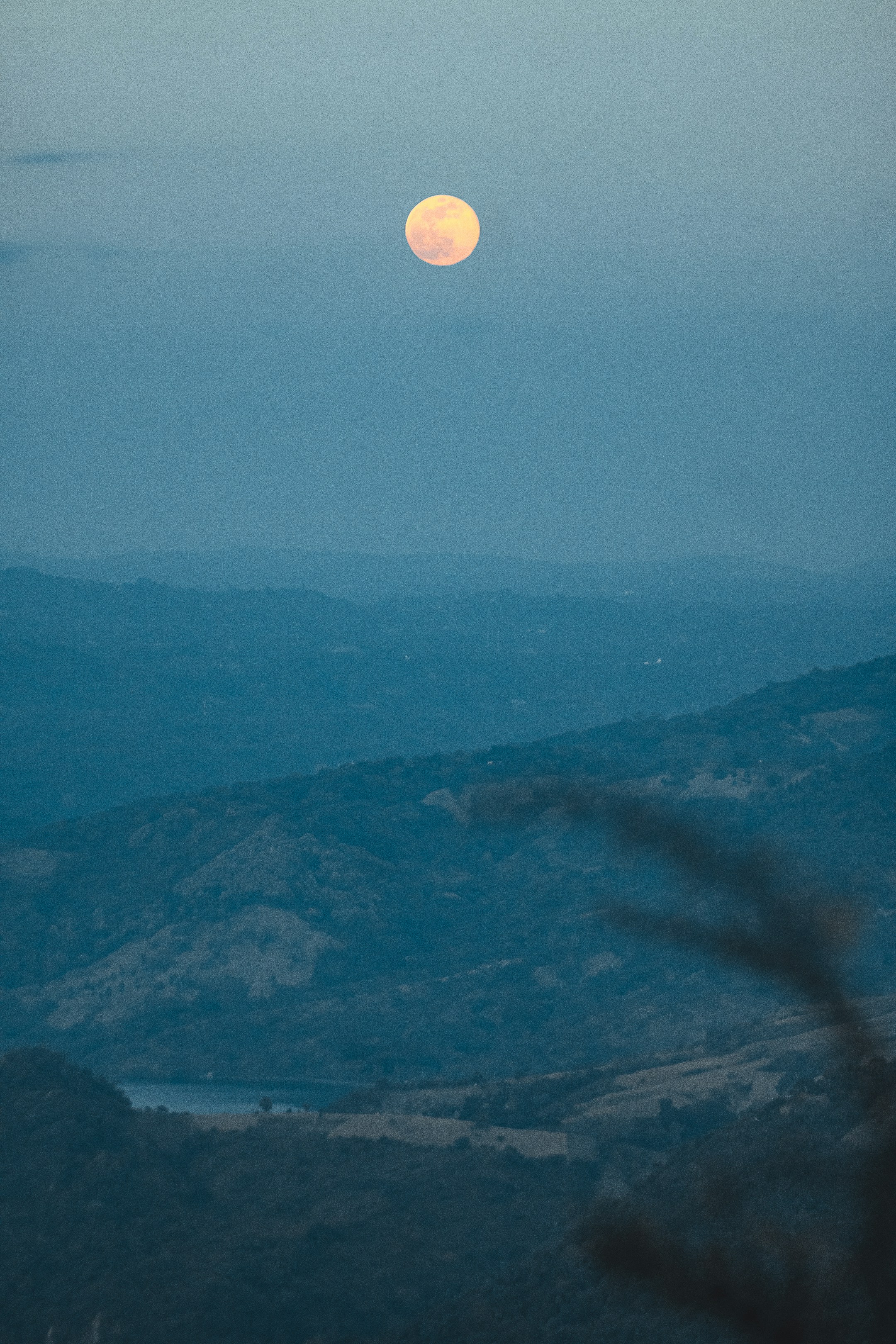Full Moon Over Distant Hills