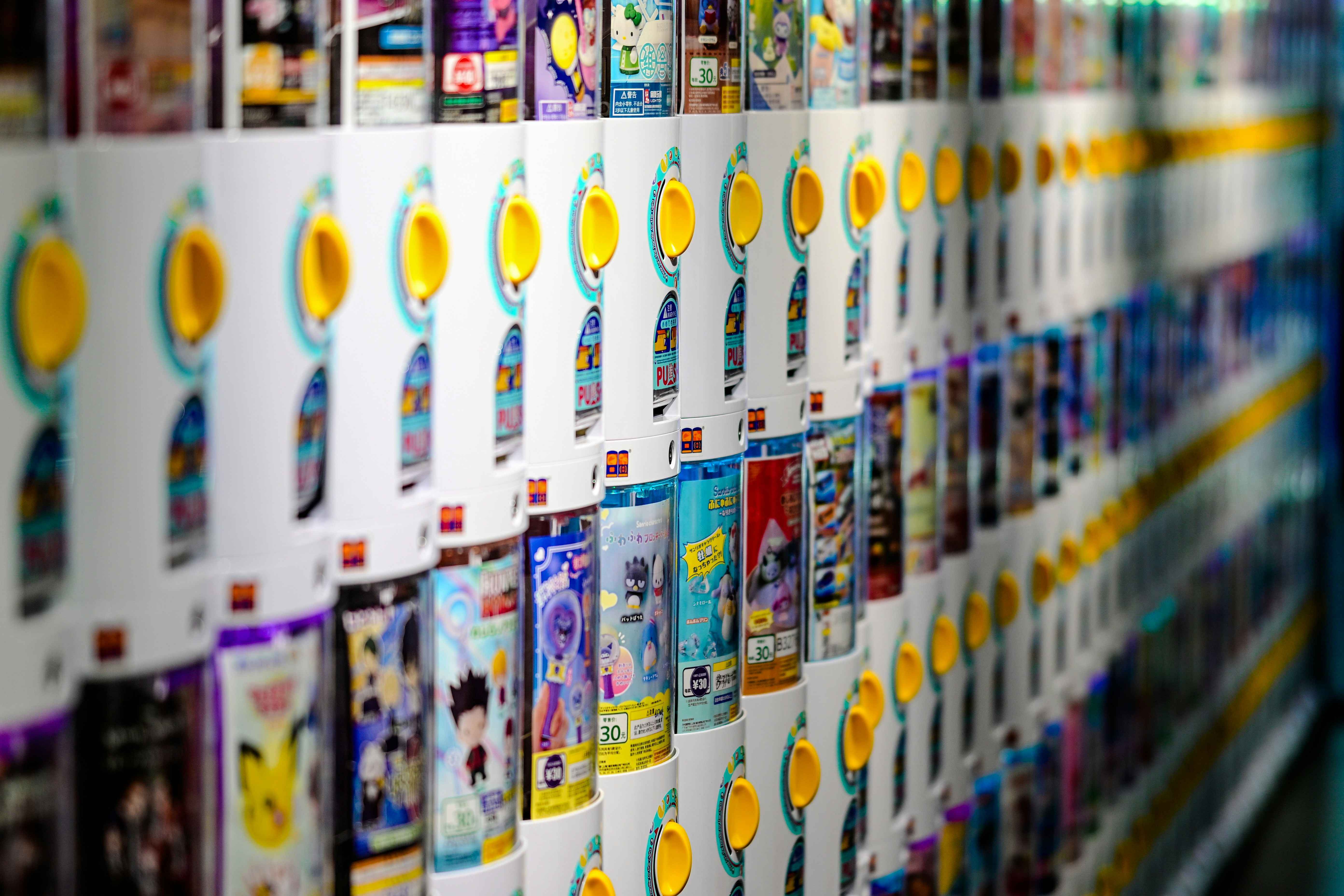 Colorful Capsule Cascade: A Wall of Gumball Machines in Motion