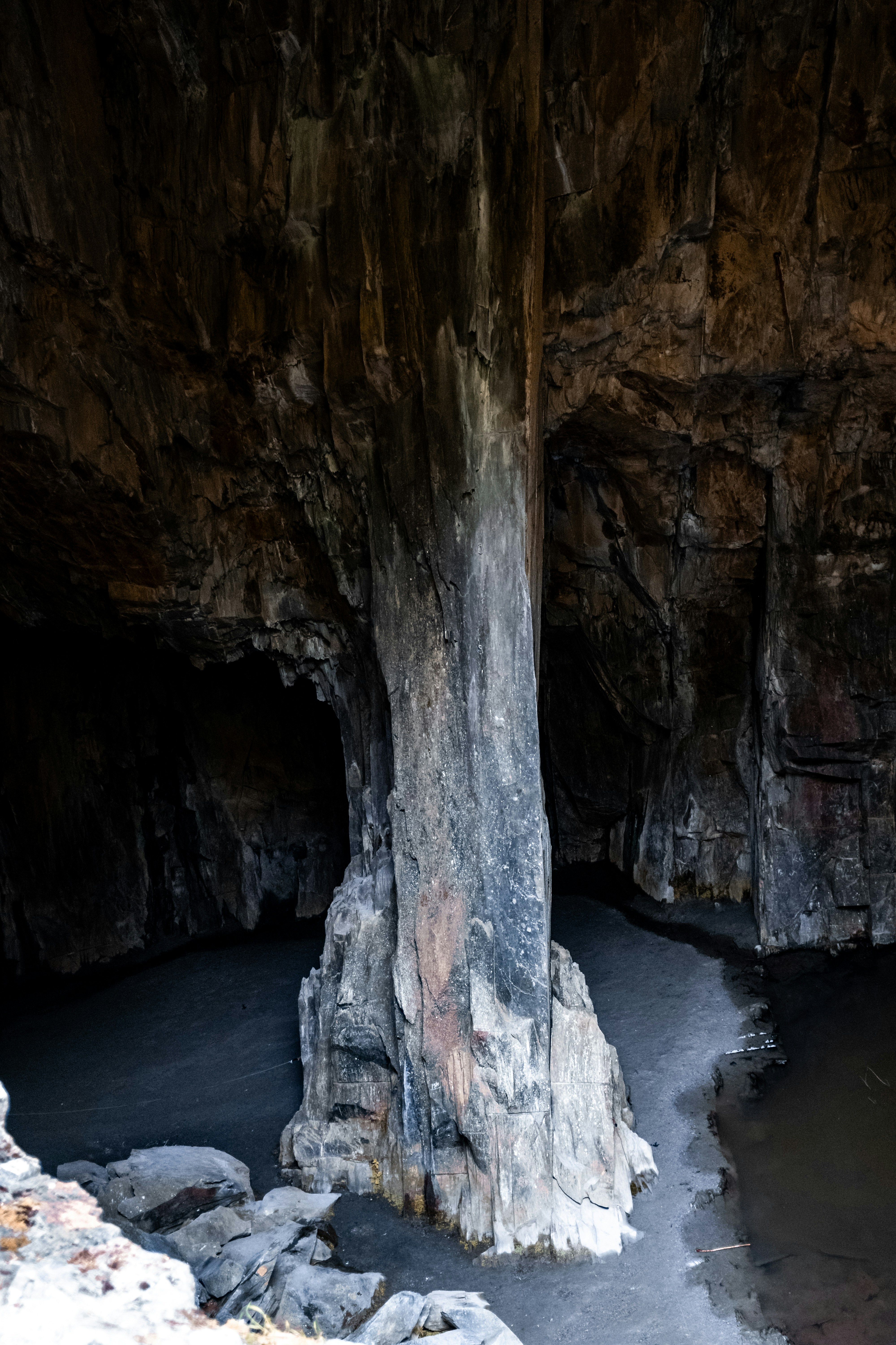 Central Column in a Dark Cavern Pool