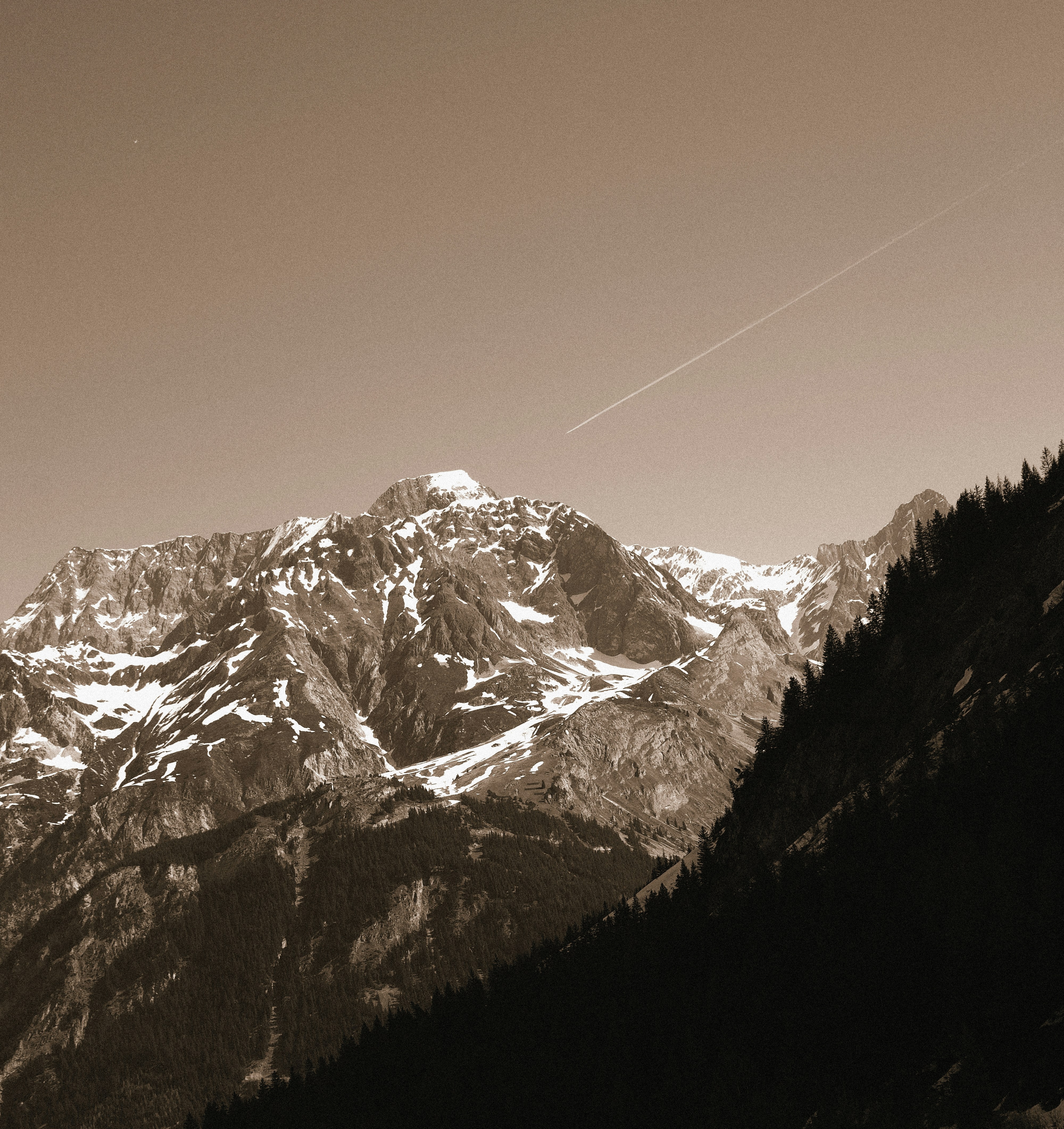 Alpine Peak Under a Meteor Trail