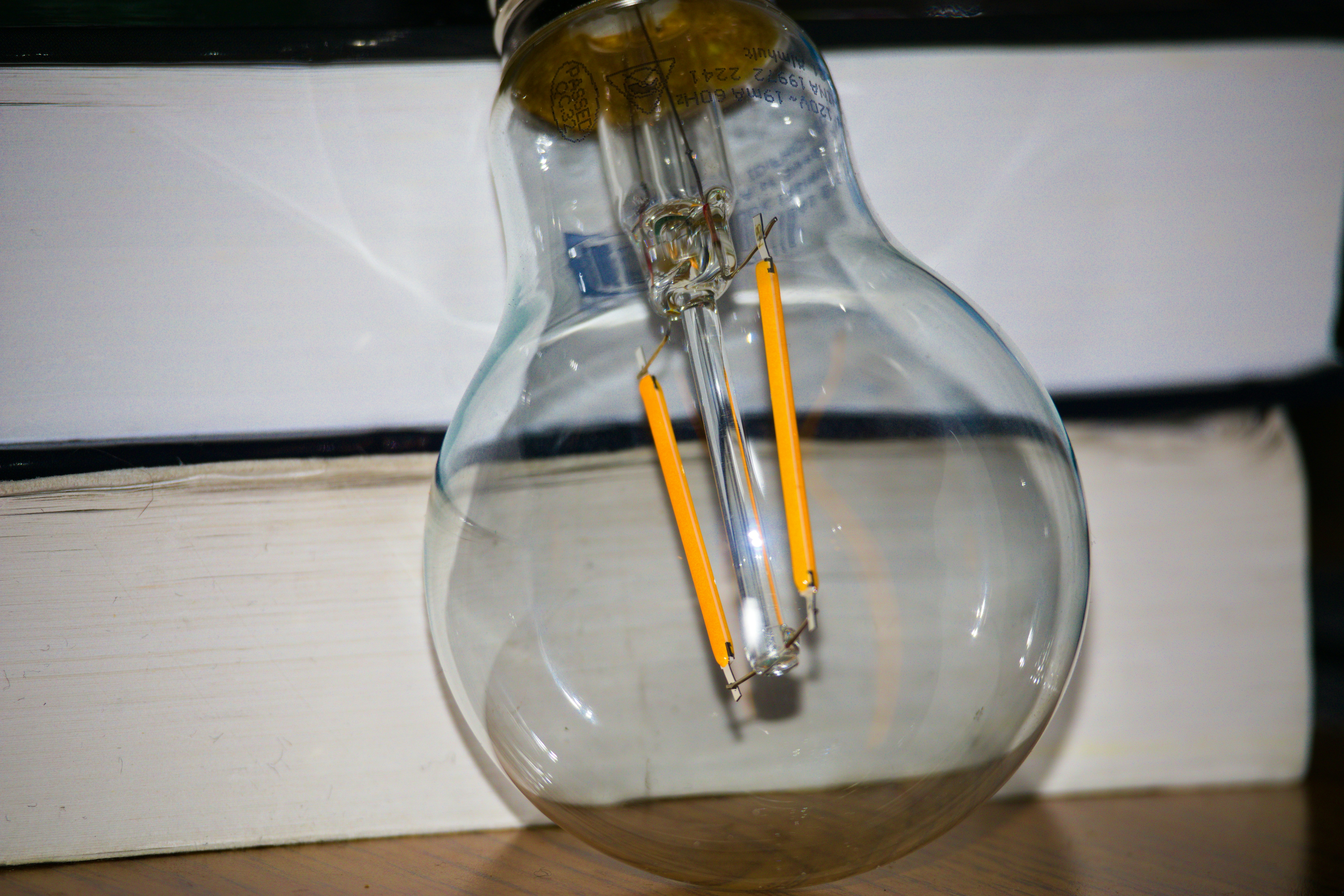 Inside the Glow: A Lamp Filament Poised in Clear Suspension