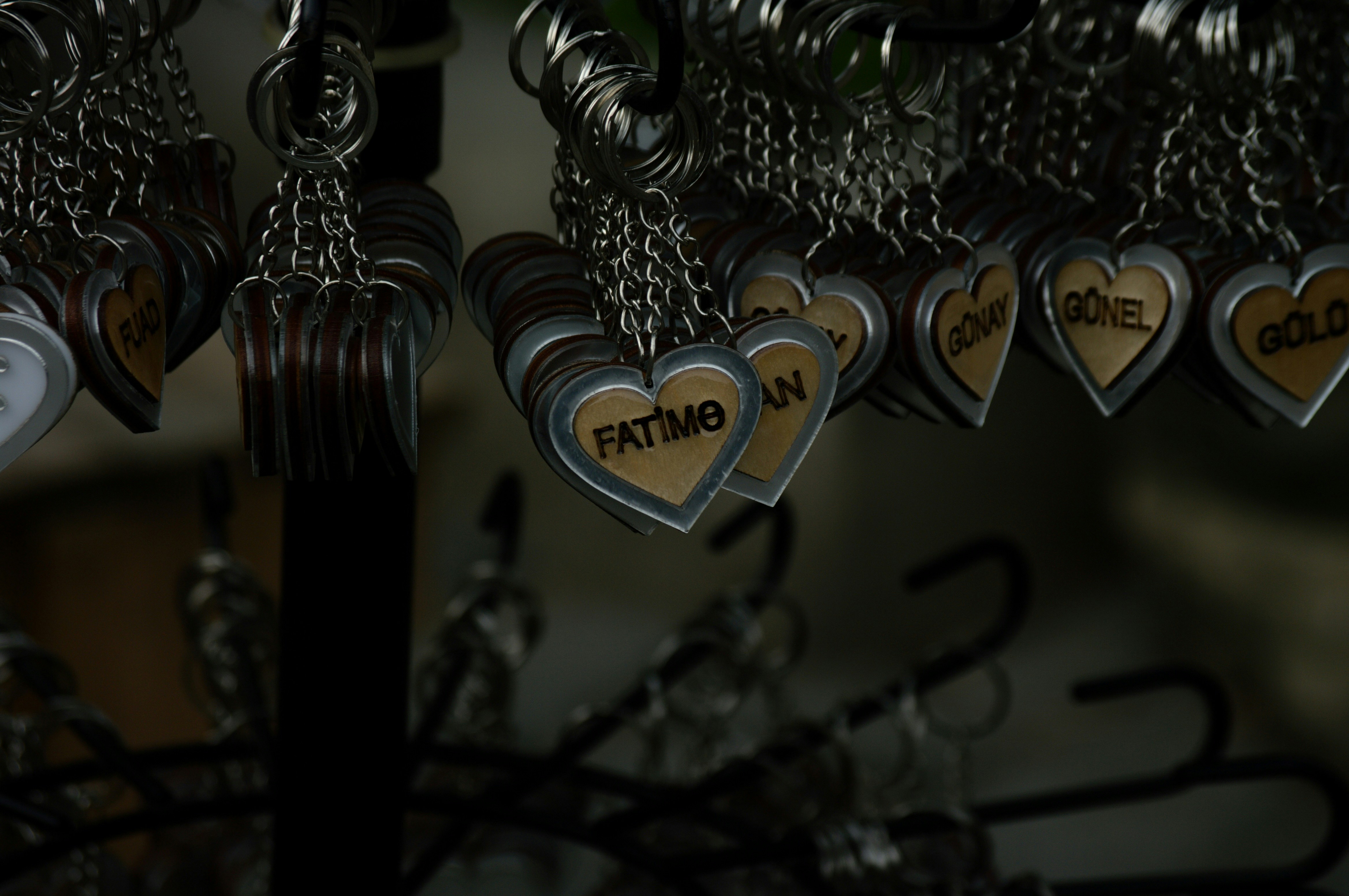 Heart-Shaped Keychains Dangle in Dim Display