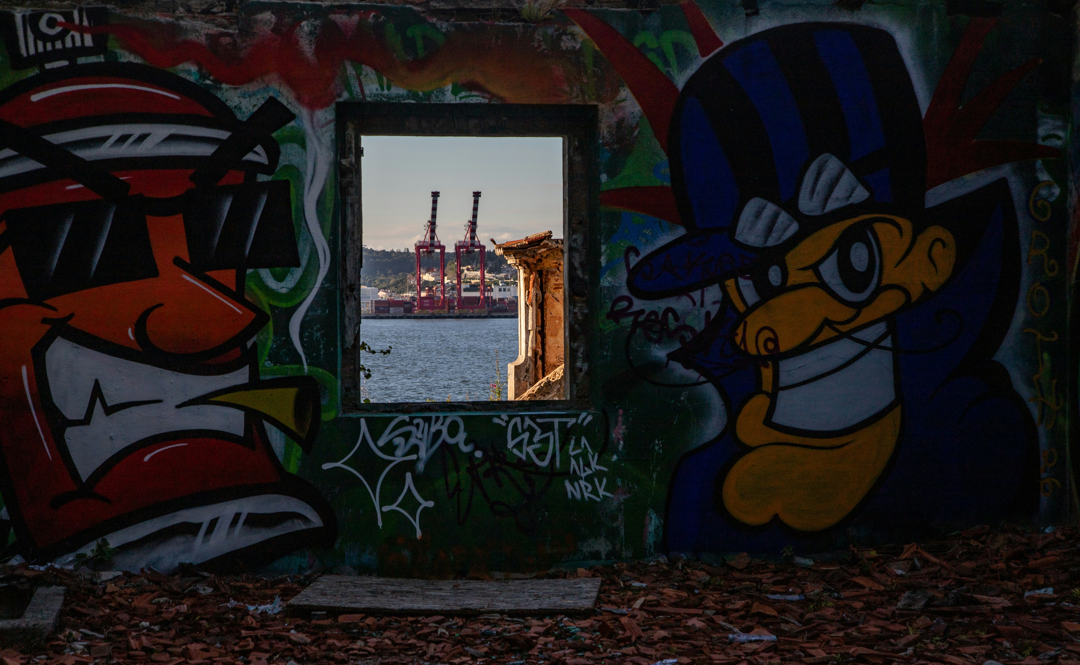 Window to the Port: Graffiti Fortress Framing a Harbor Scene