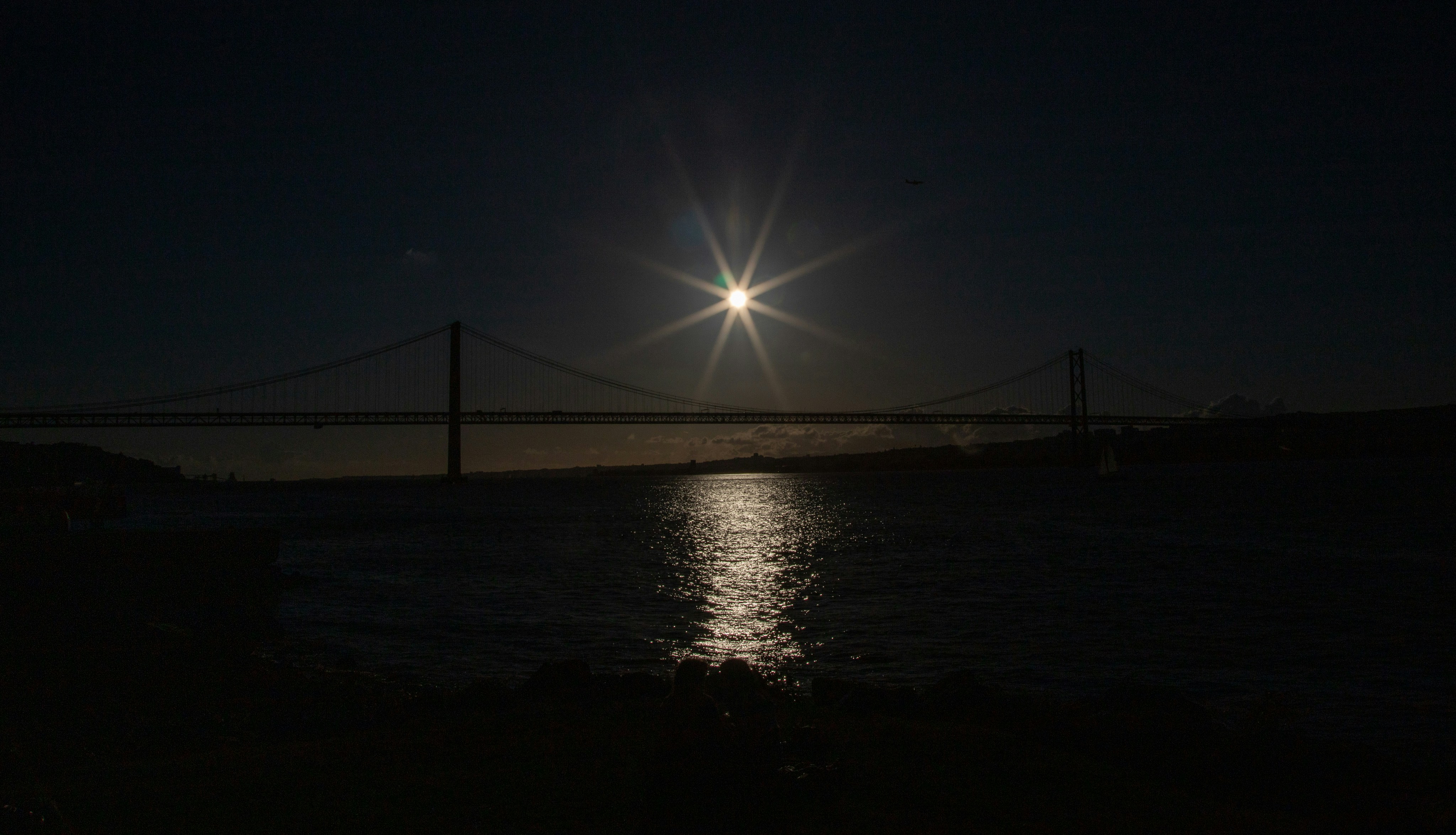 Moonlit River Crossing: Night Scene with a Starburst Bridge