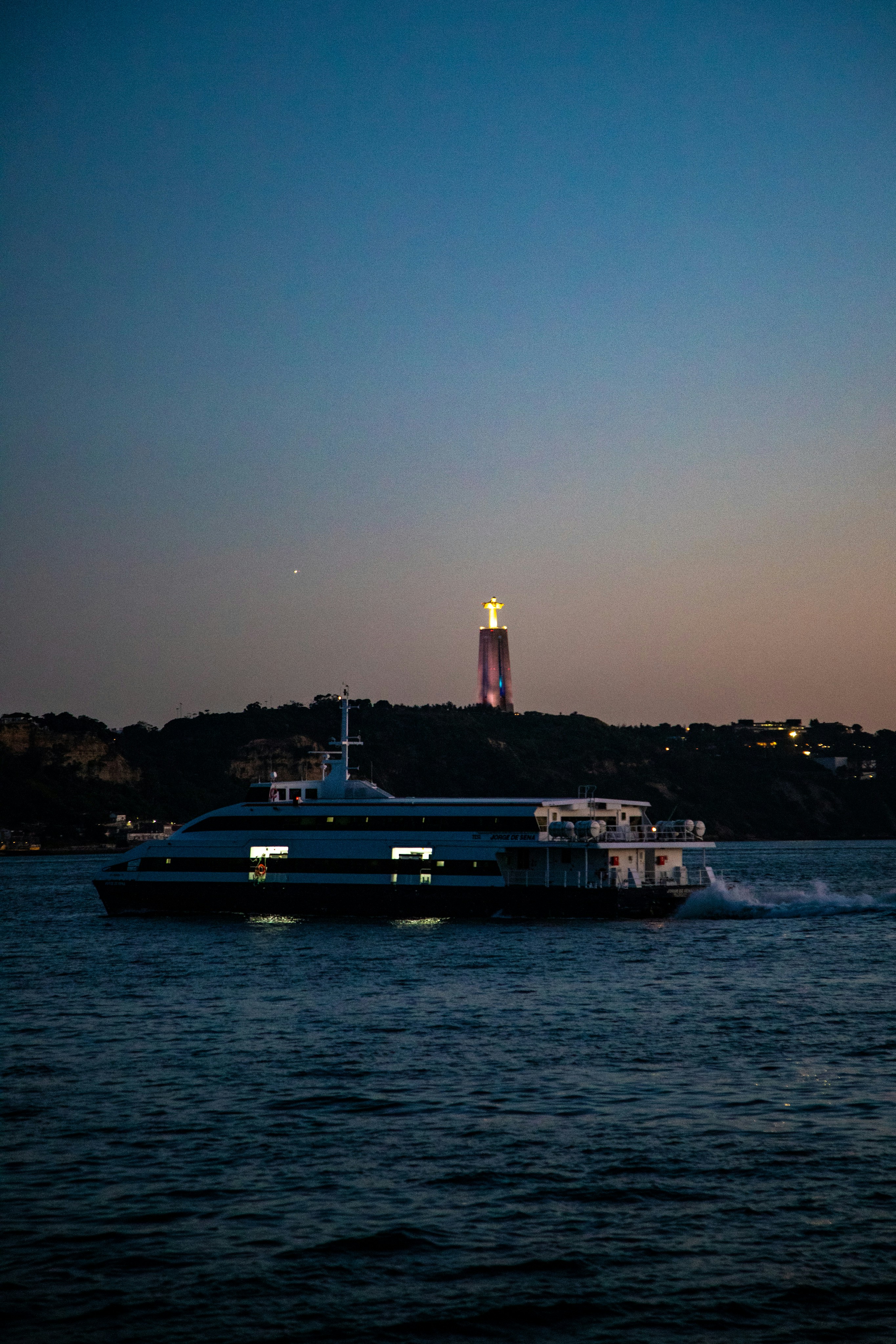 Dusk Ferry Gliding Past a Quiet Shoreline