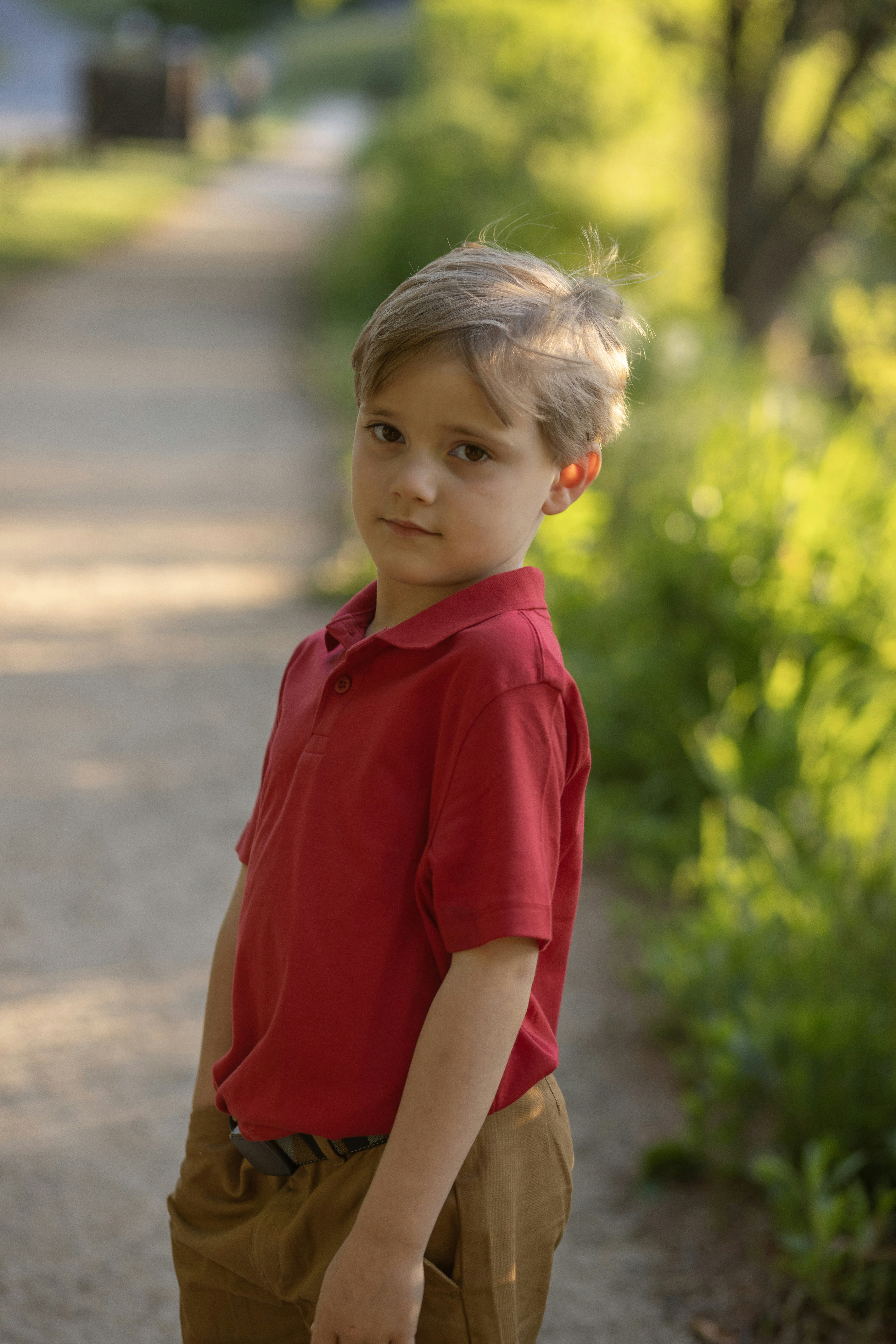 Youthful Curiosity on a Sunlit Path