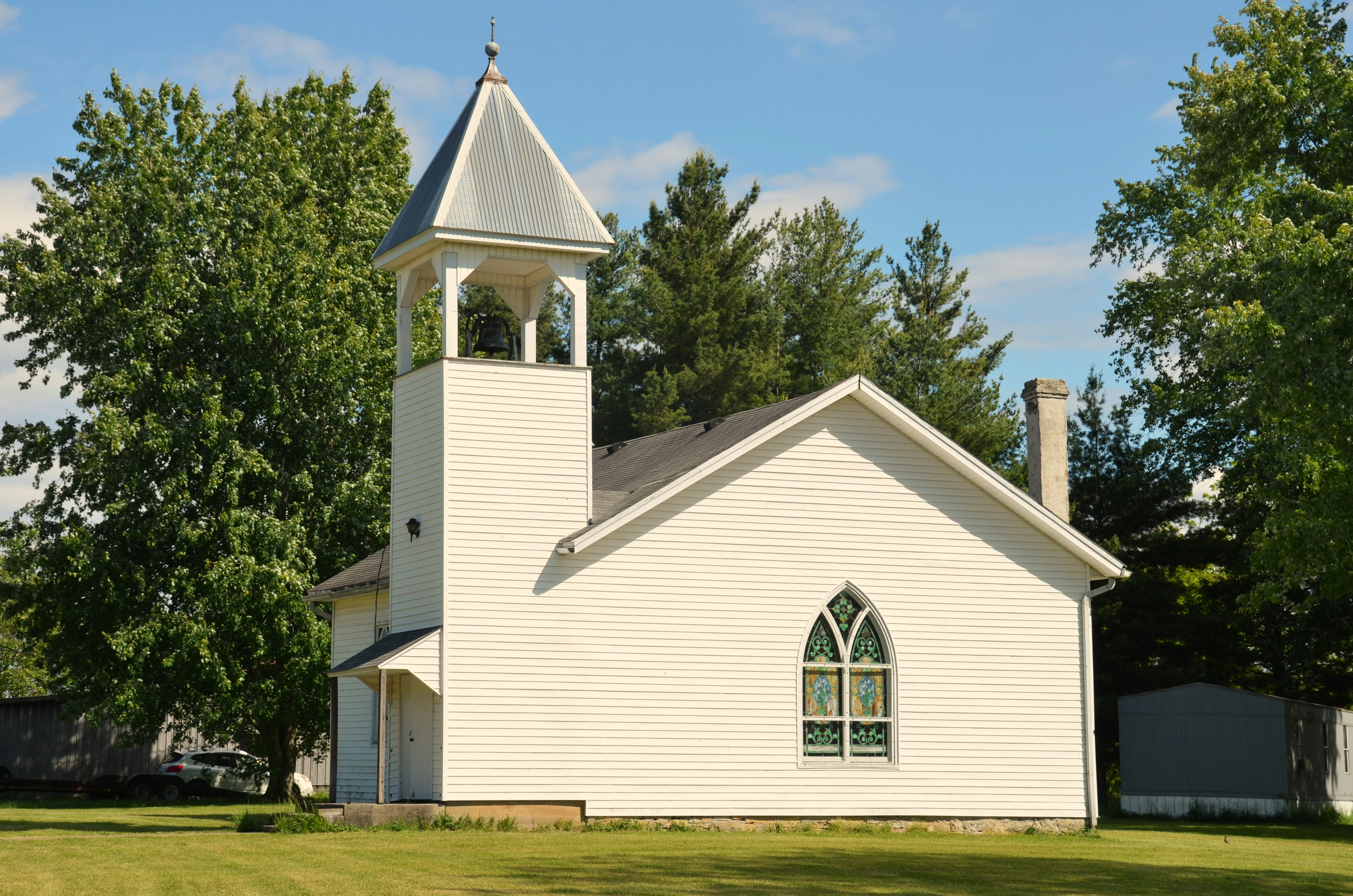 White Chapel in Sunlit Reflection