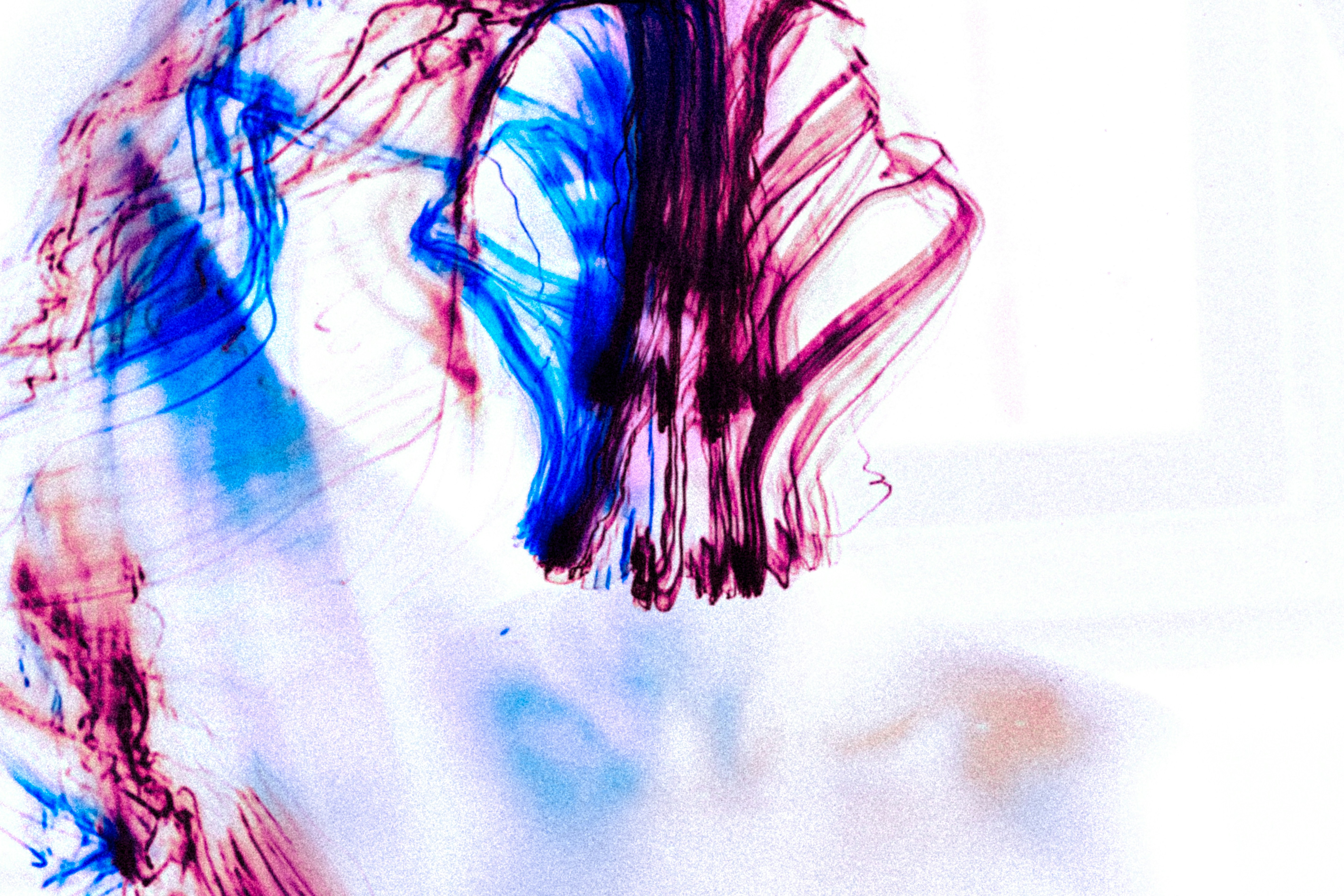 Ink in Flow: Colored Plume Amid Ethereal Translucence
