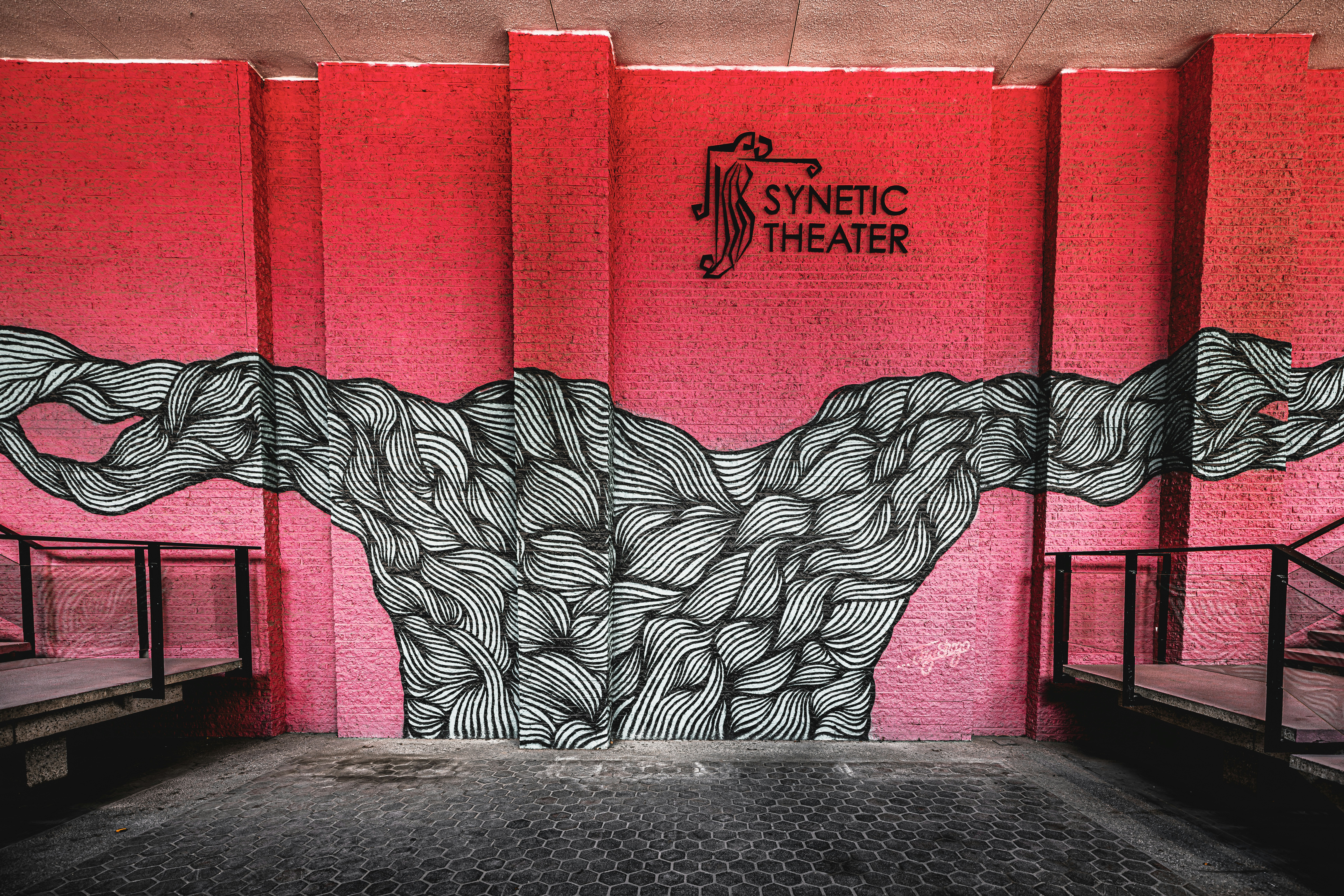 Tangled Threads: Red Wall Mural Surging Like Hairy Roots