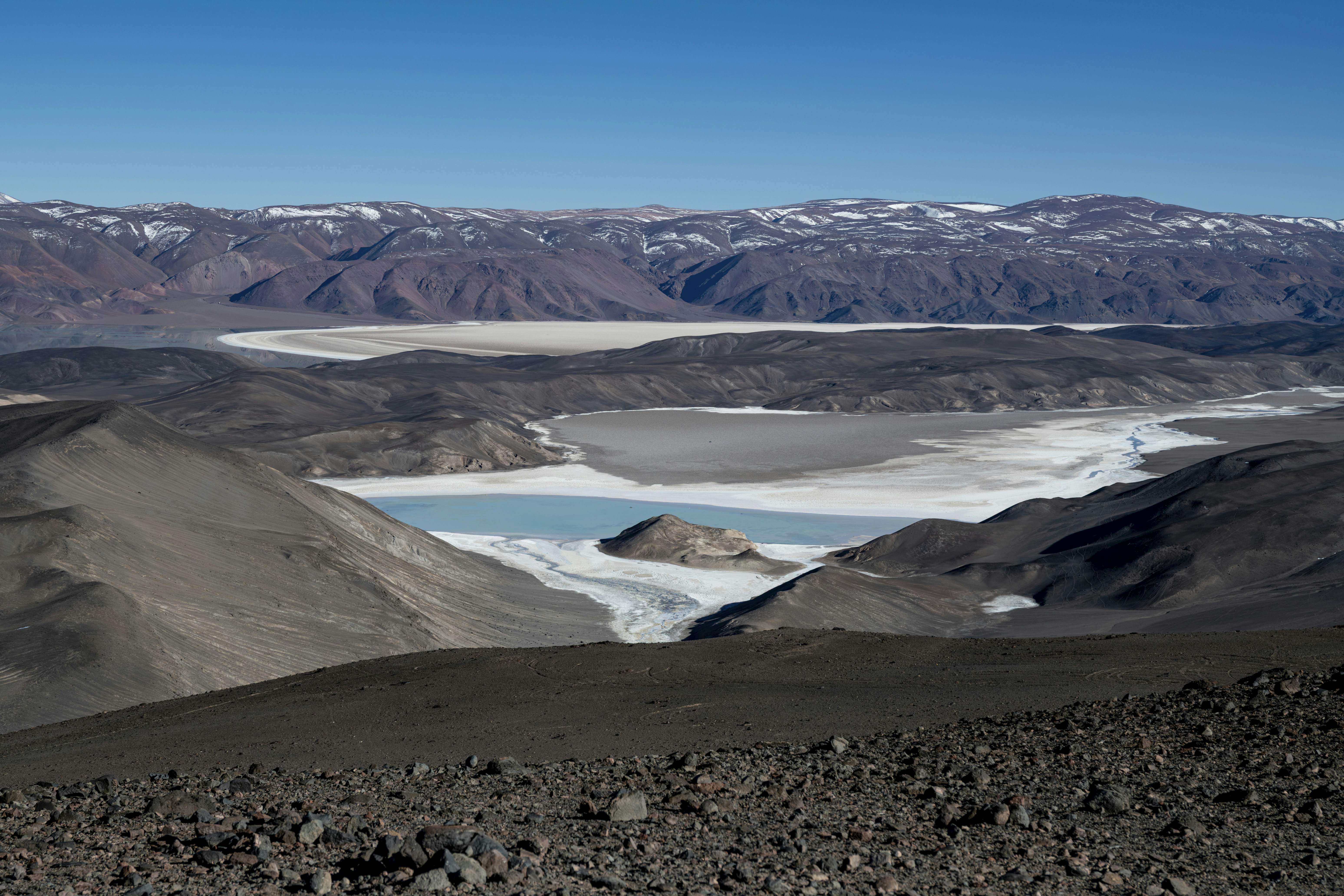 Ridge and Ice: A Deserted Basin Under a Clear Arctic Sky