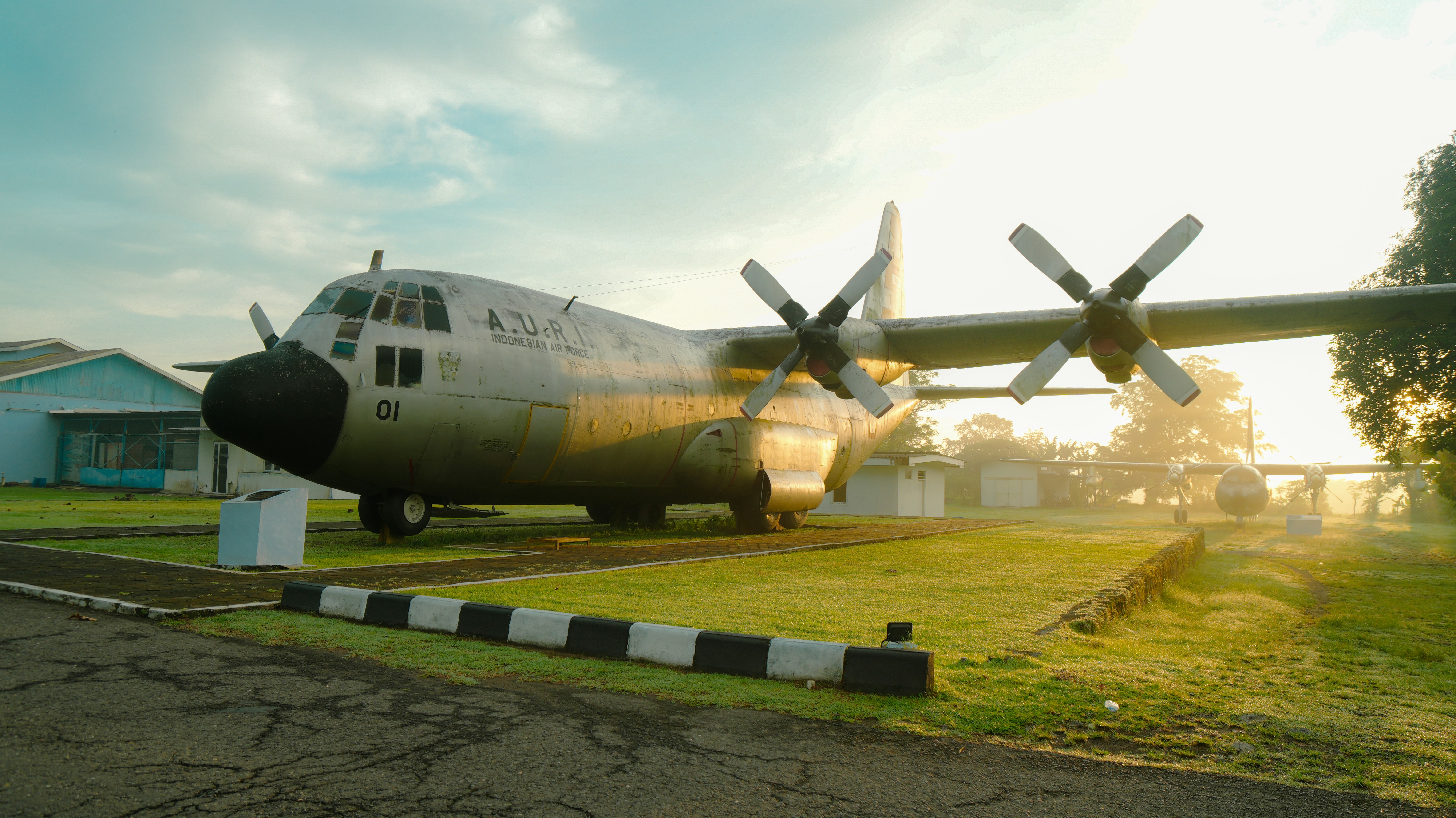 Sunlit Spartan Cargo: A WWII-era Aircraft Resting in the Sky-Soft Field