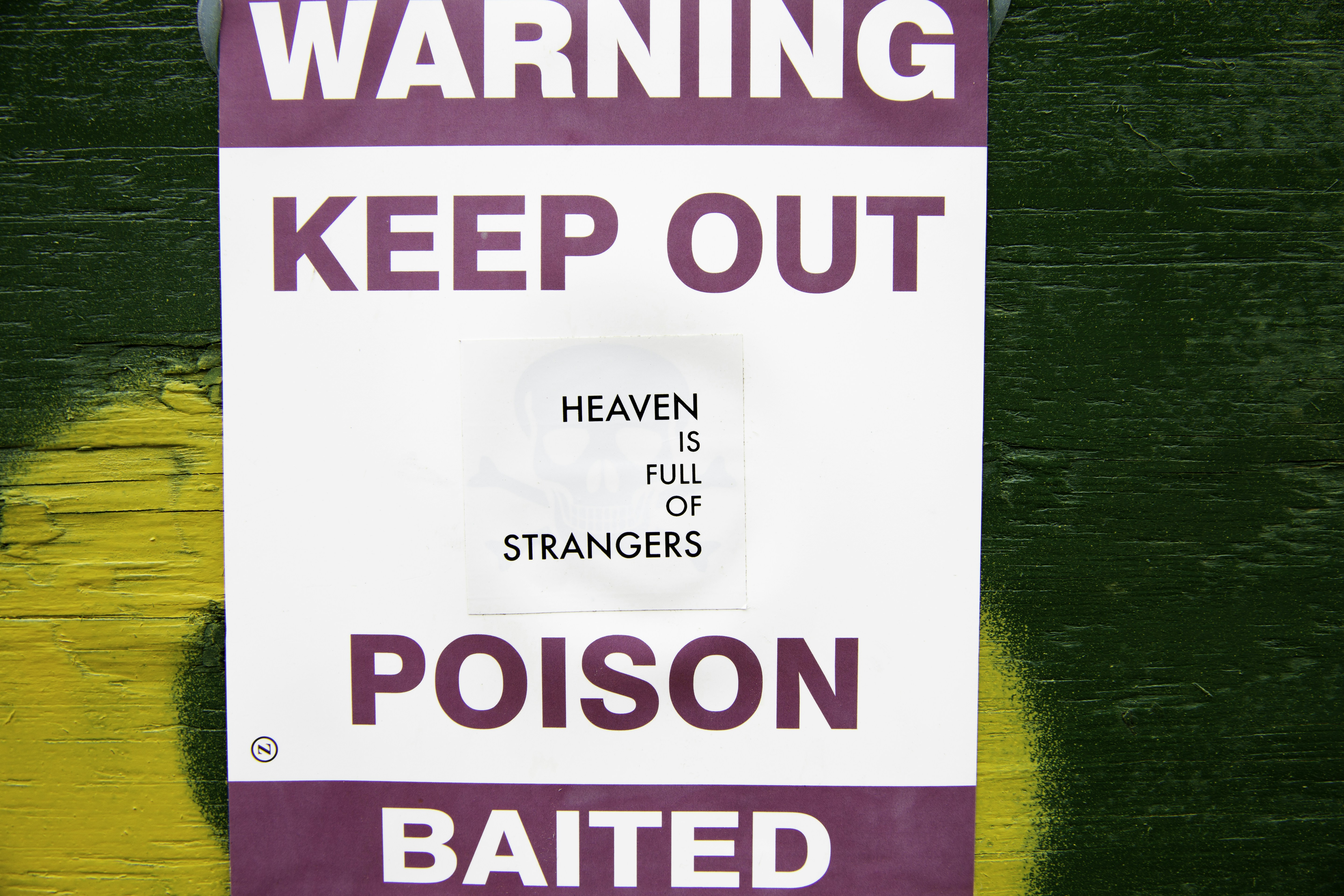 Poison Sign on a Painted Green Wall