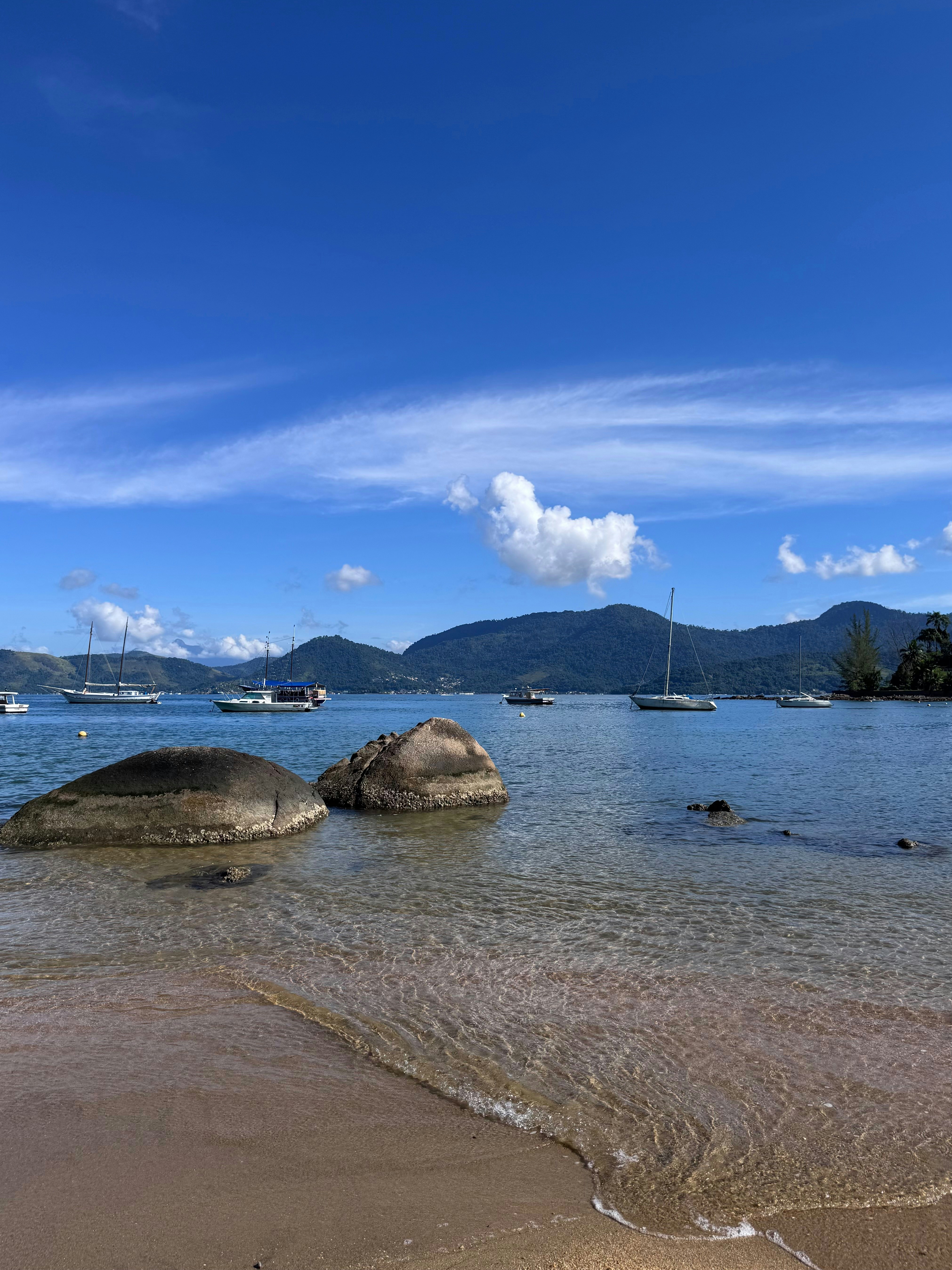 Coastal Calm: Boats at Rest Under a Bright Blue Sky