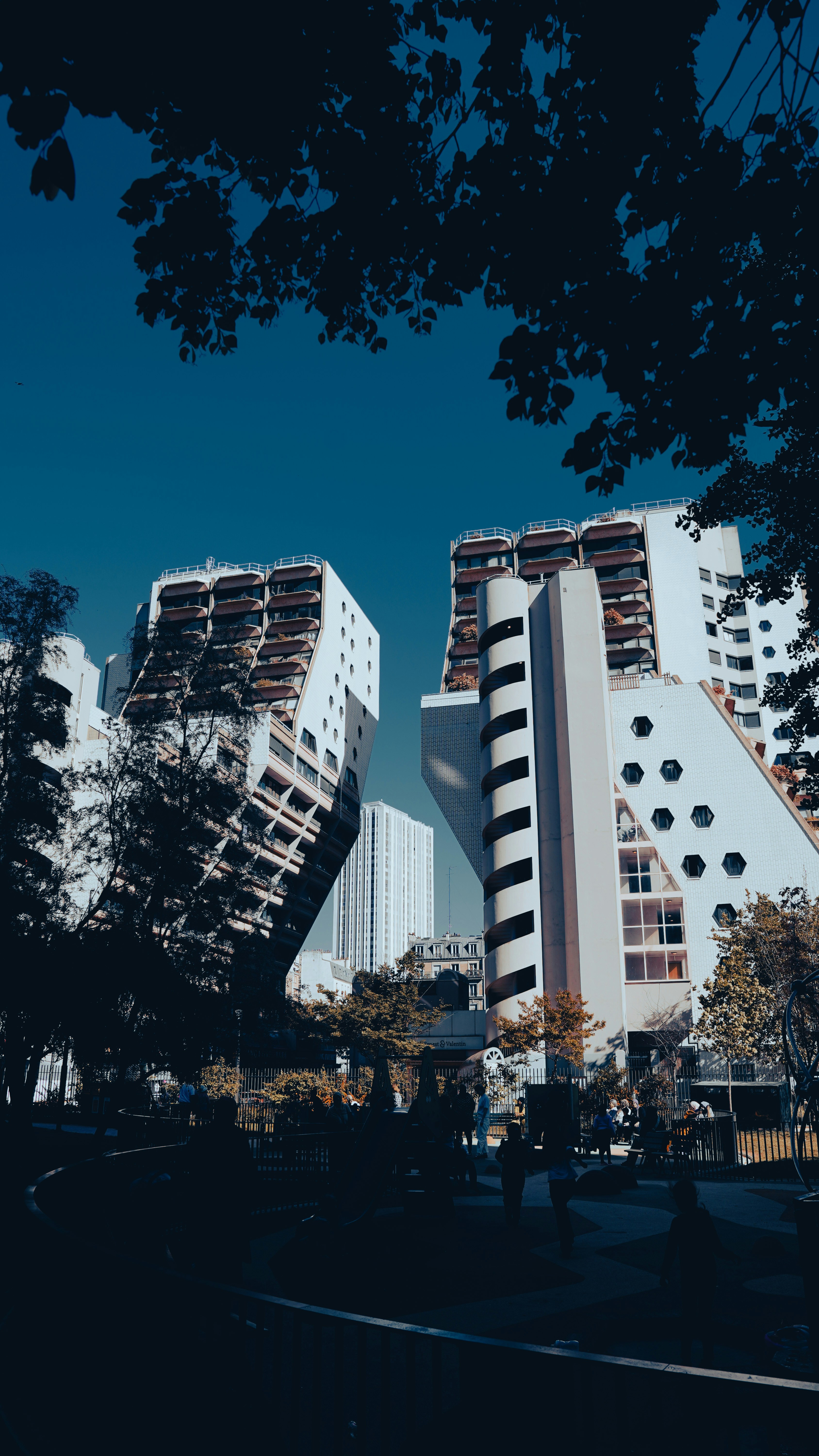 Urban Sculptures: Concrete Buildings Tilt Toward the City Sky