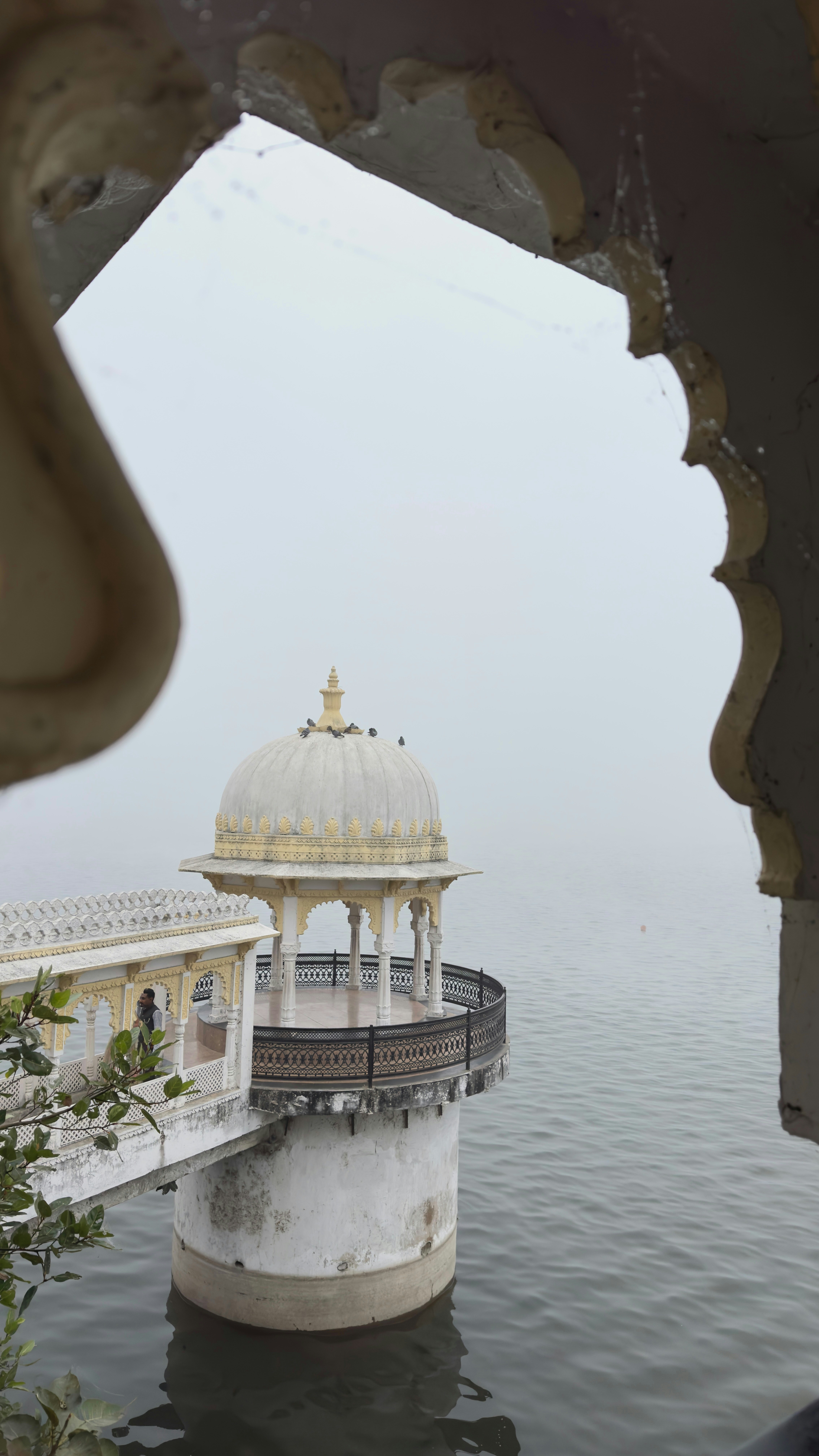Dome over the Lake: a pale pavilion framed by an arch