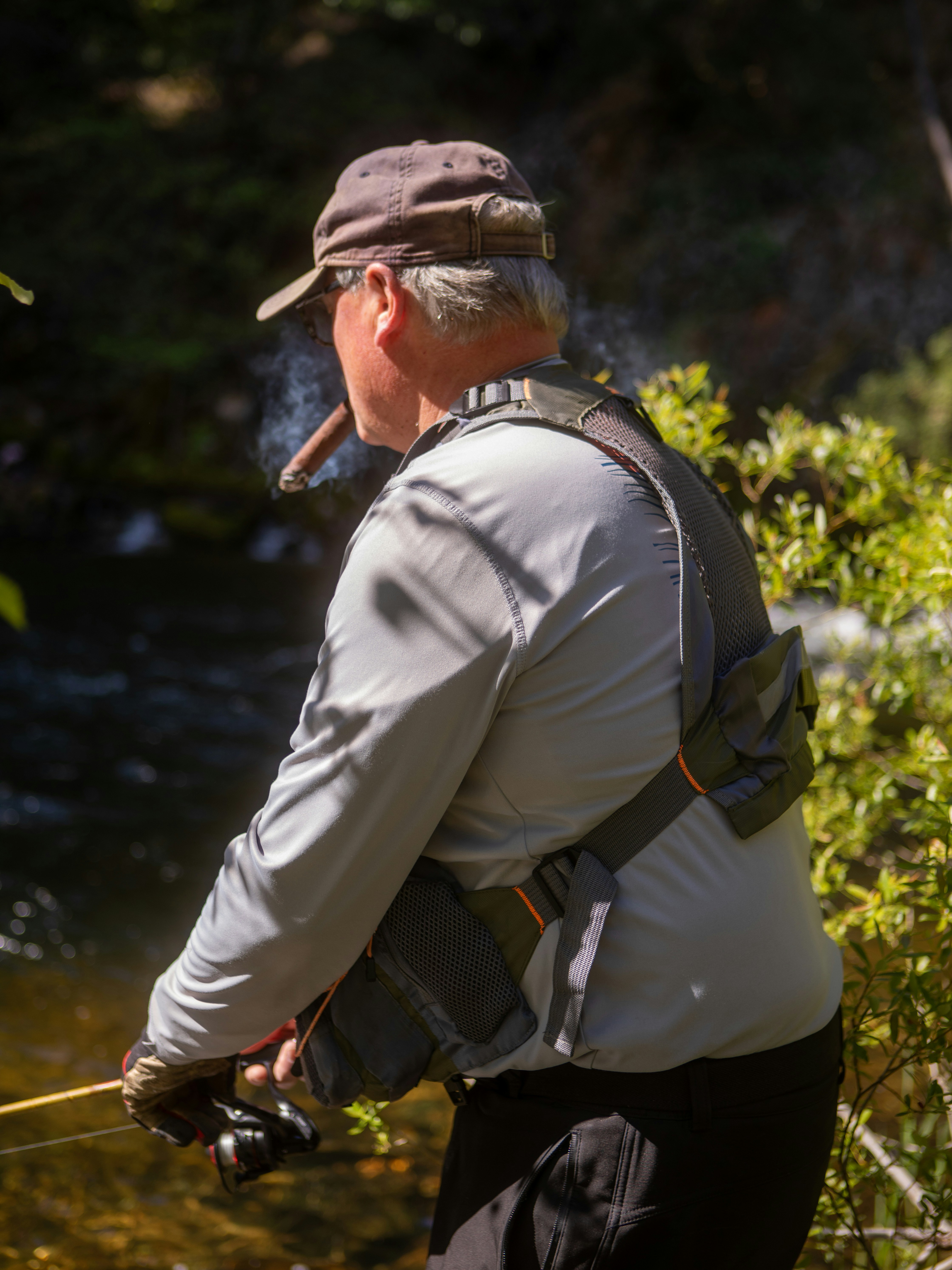 The Angler at Dusk: A Quiet Moment by the Stream