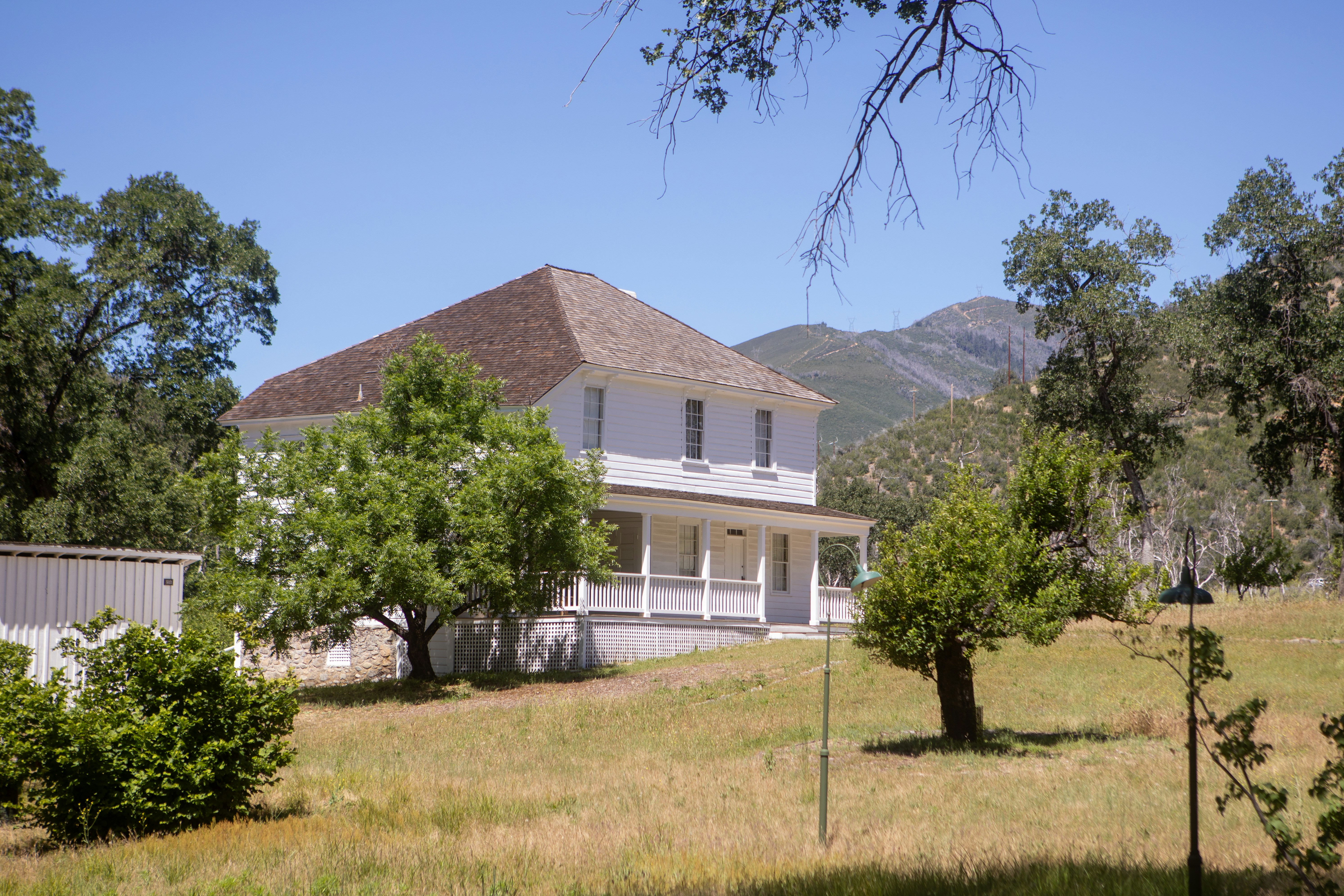 Dusty hillside villa under a sapphire sky