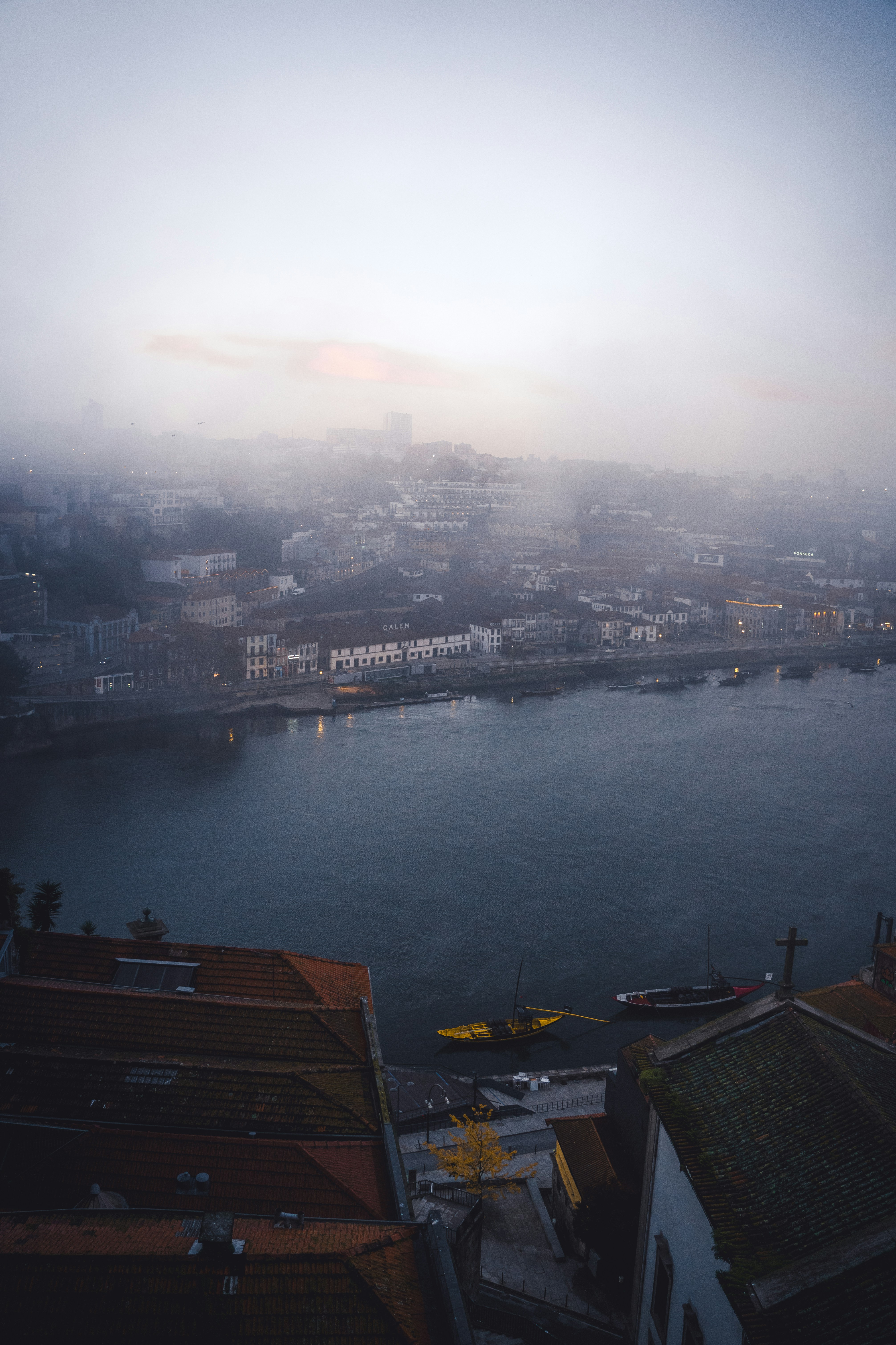 Misty Riverside Terrace: Evening Cityscape from the Rooftop