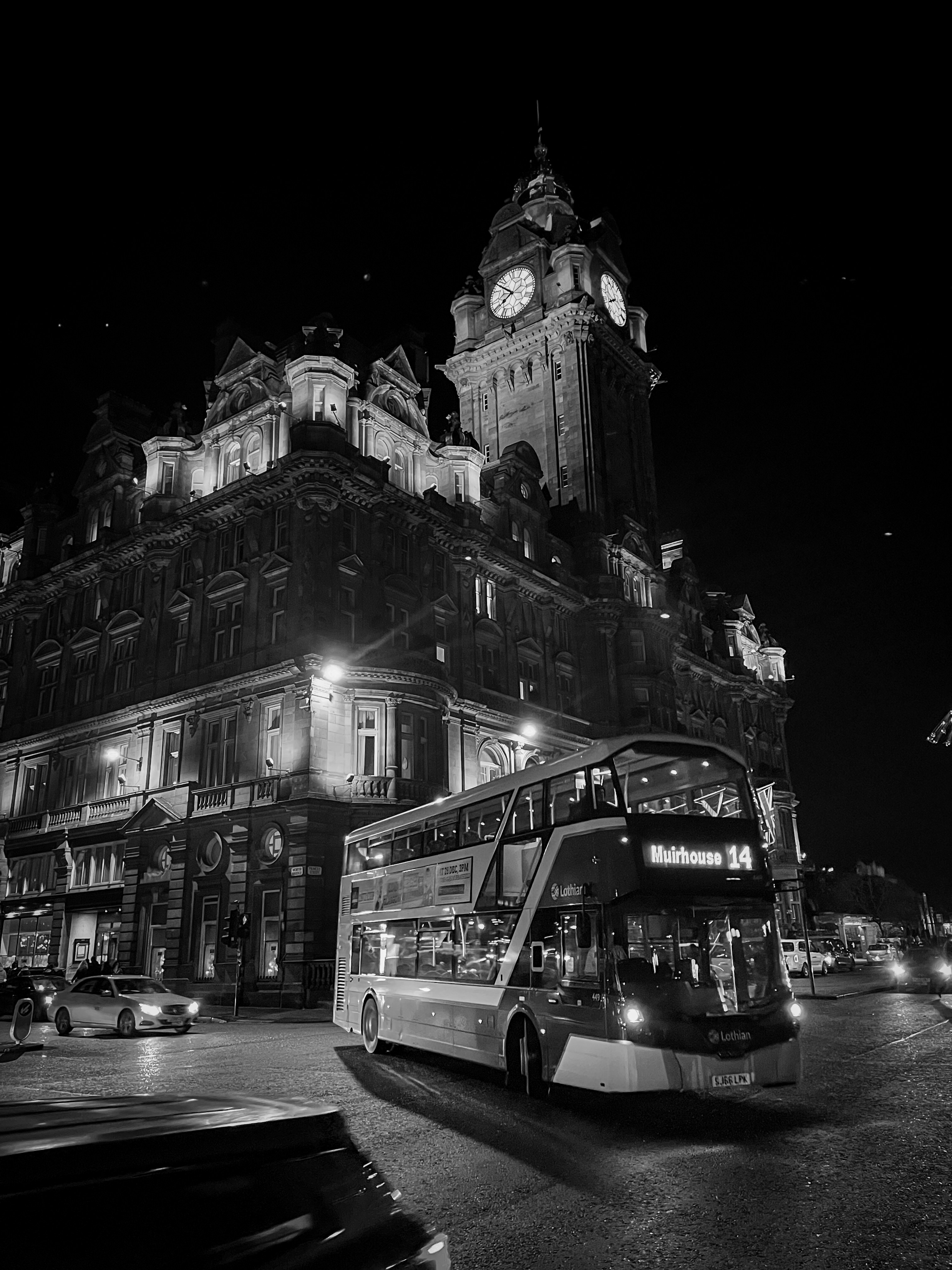 Night at the Clocktower: A Woolwich-like Cityscape with a Double-Decker Contending the Facade