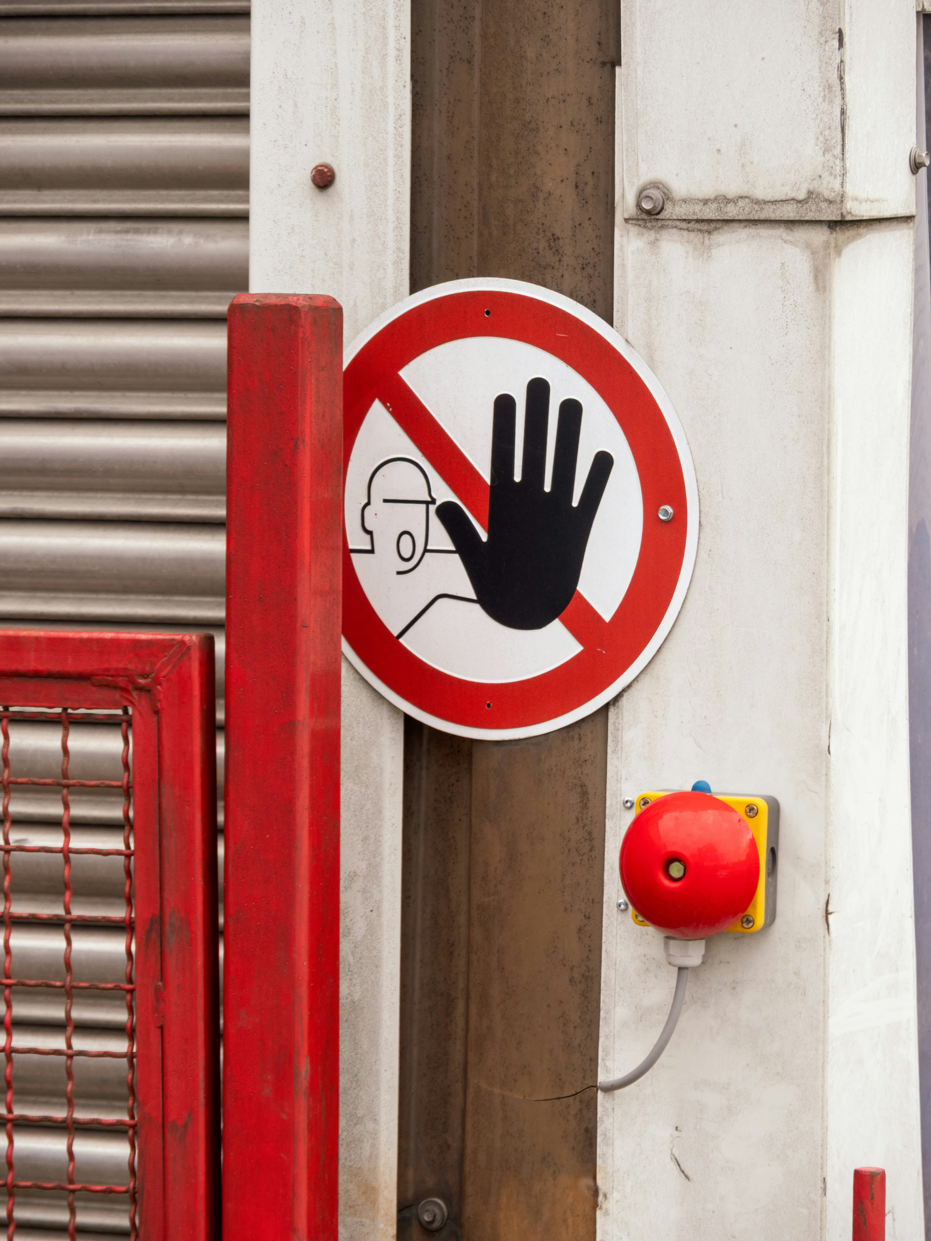 Raised Hand, Red Barrier: Urban Signage at the Threshold