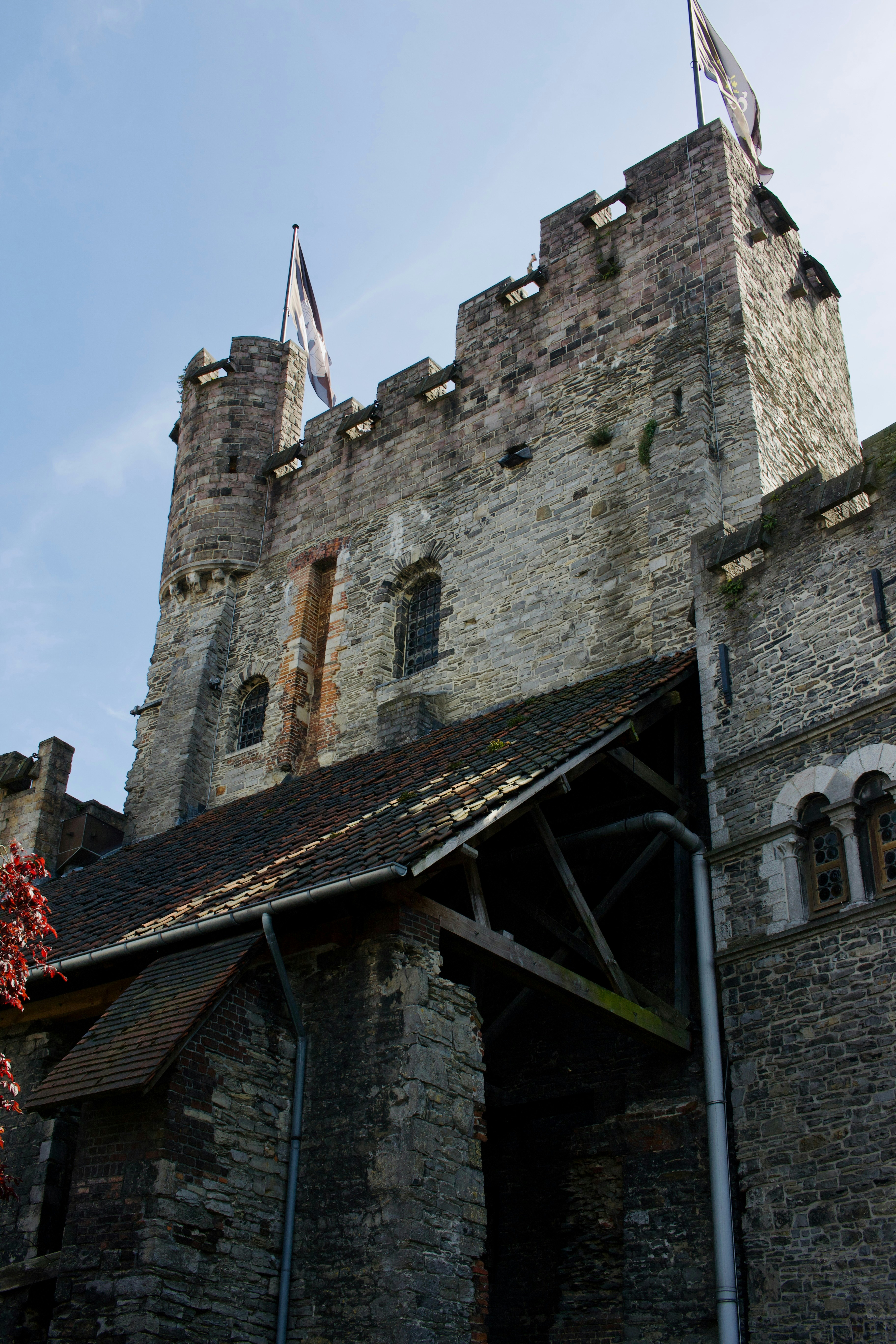 Stone Sentinel: A Fortress Tower under Clear Spring Sky