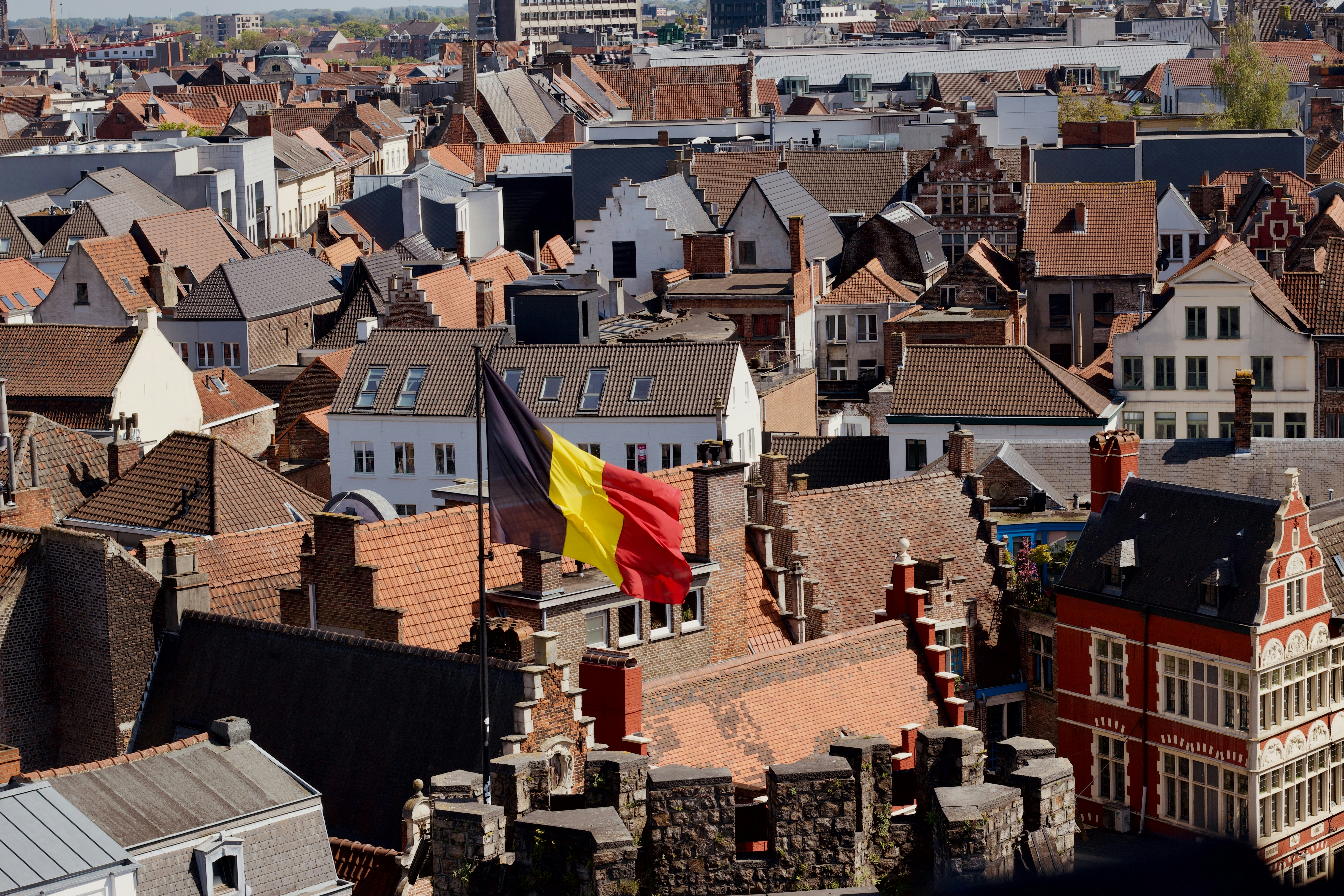 Flag over medieval rooftops: a Belgian-styled skyline from above