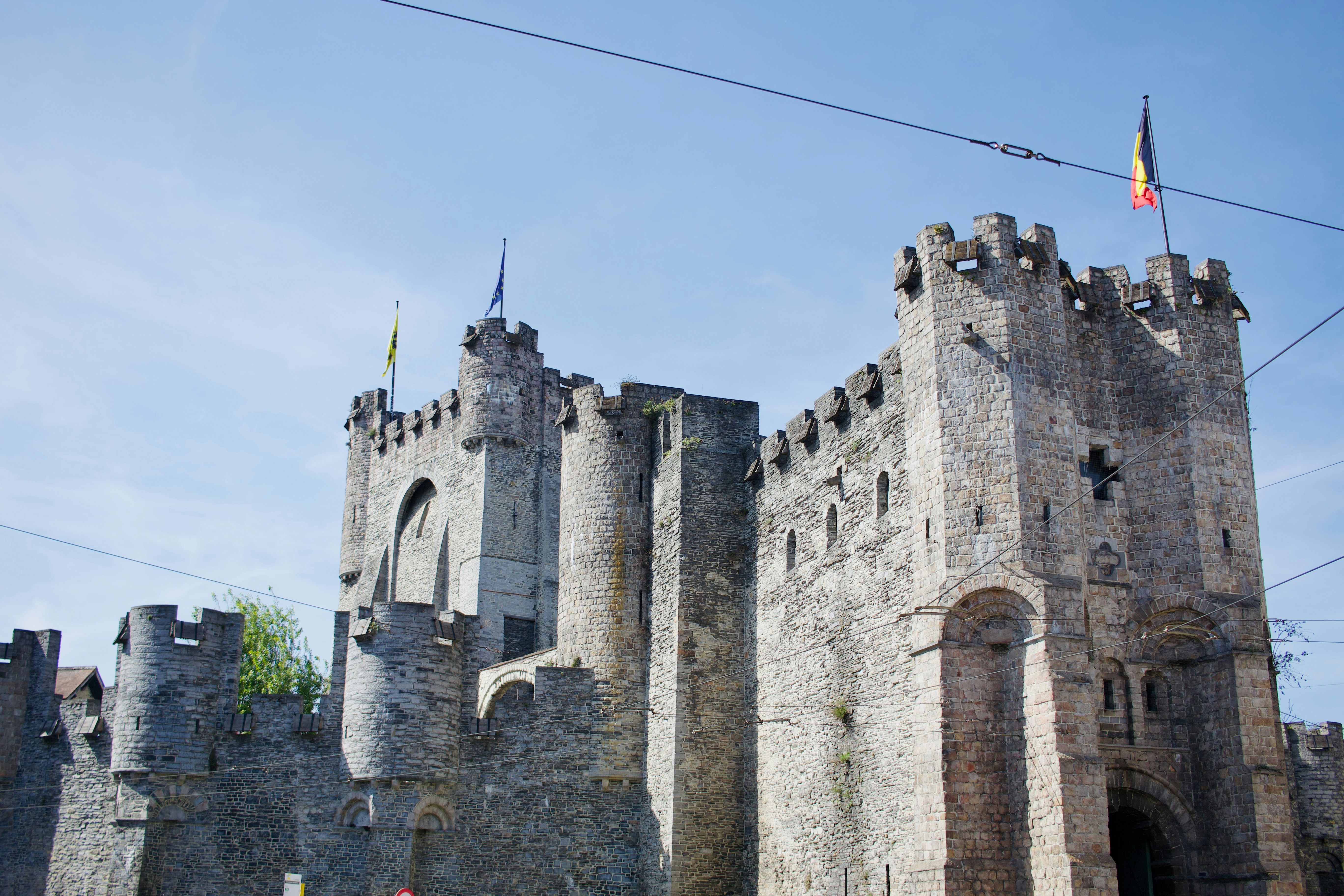 Stone Citadel: Towers Rise Against a Clear Blue Sky