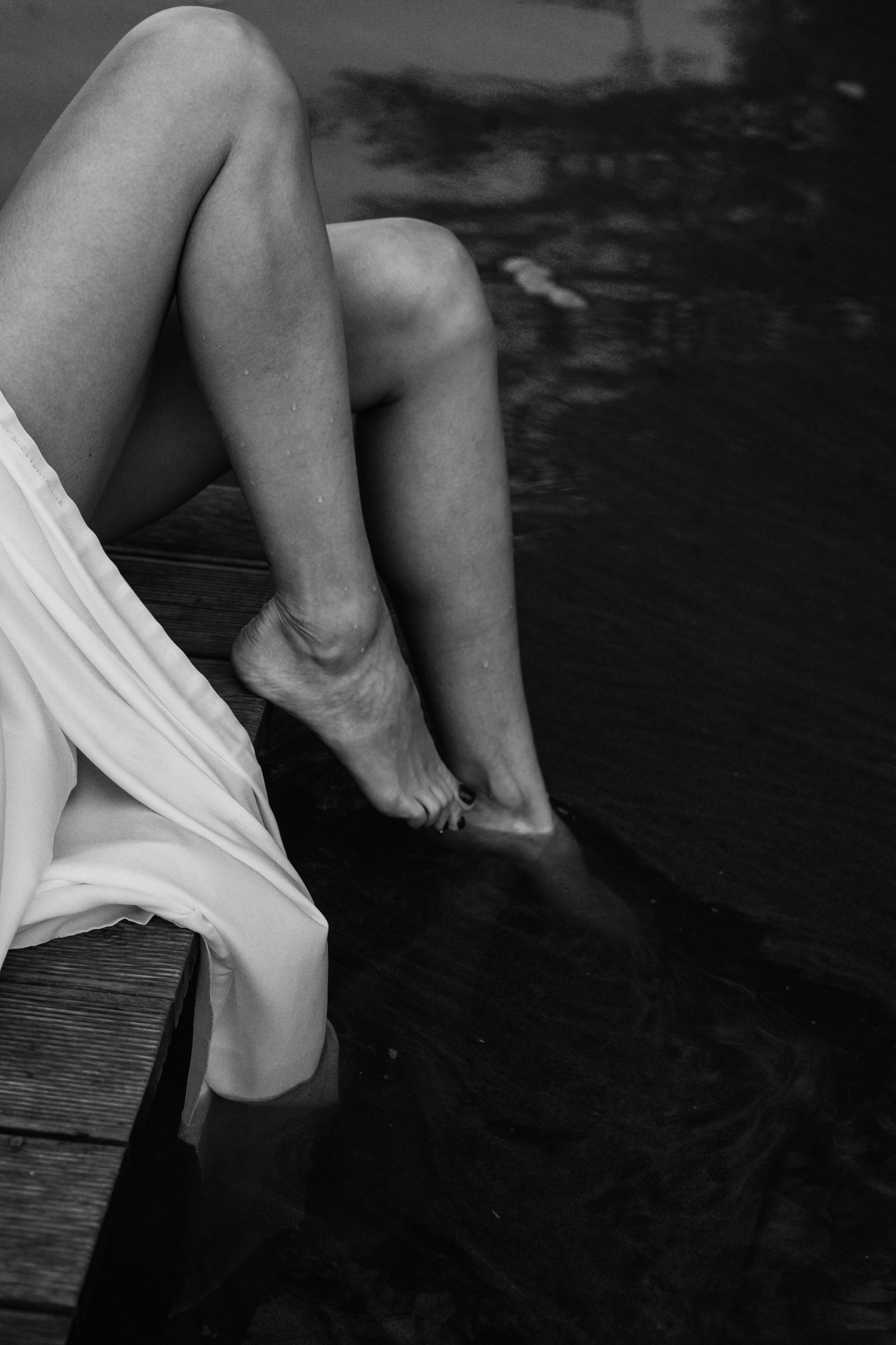 Legs at the Dock: Quiet Contemplation by the Water