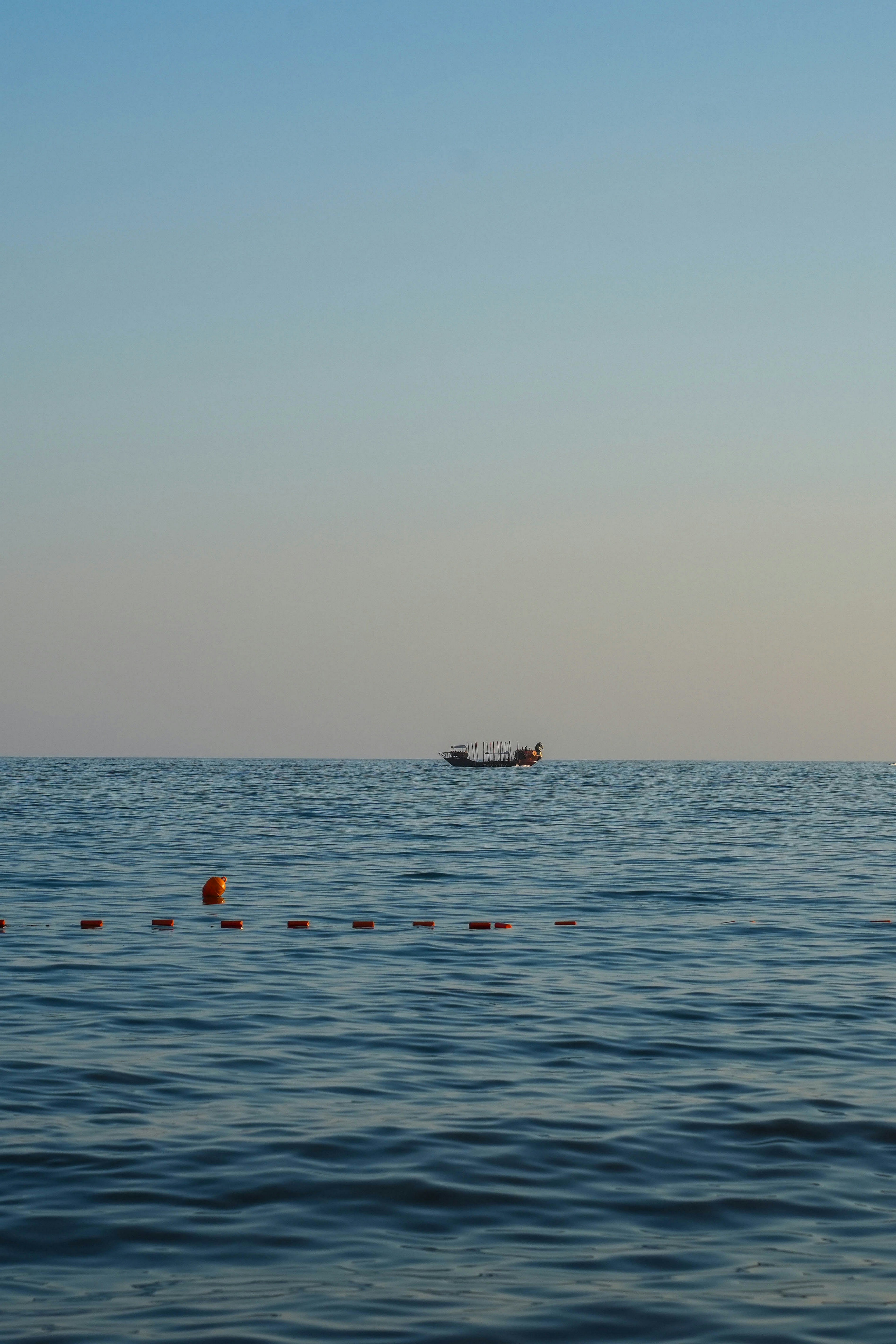 Lonely Boat on a Calm Horizon