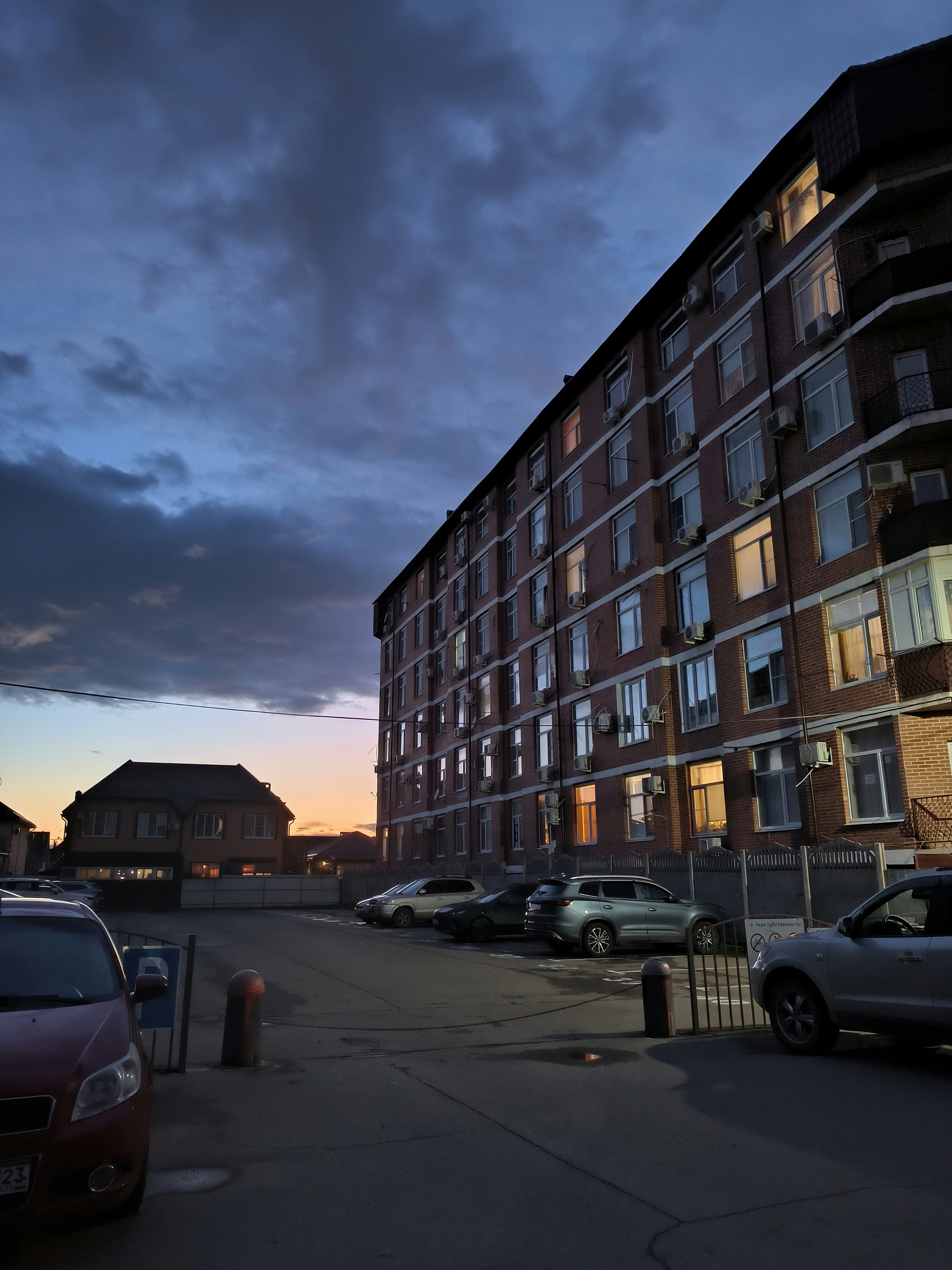 Evening Facade: A Quiet Street Gathers Toward Blue Hour