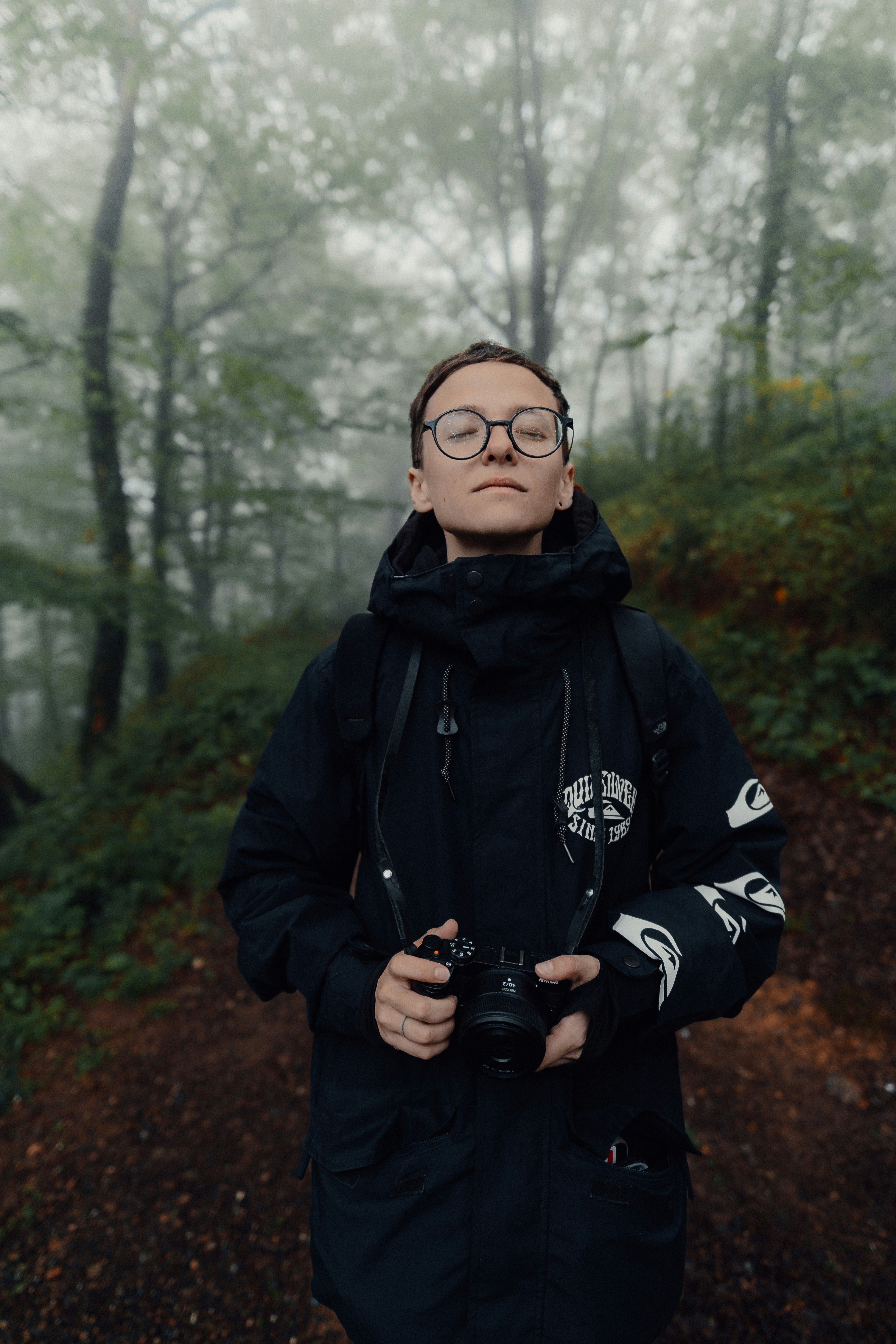 Mistlit Portrait in the Forest: Quiet Confidence with a Lens Cap of Glass