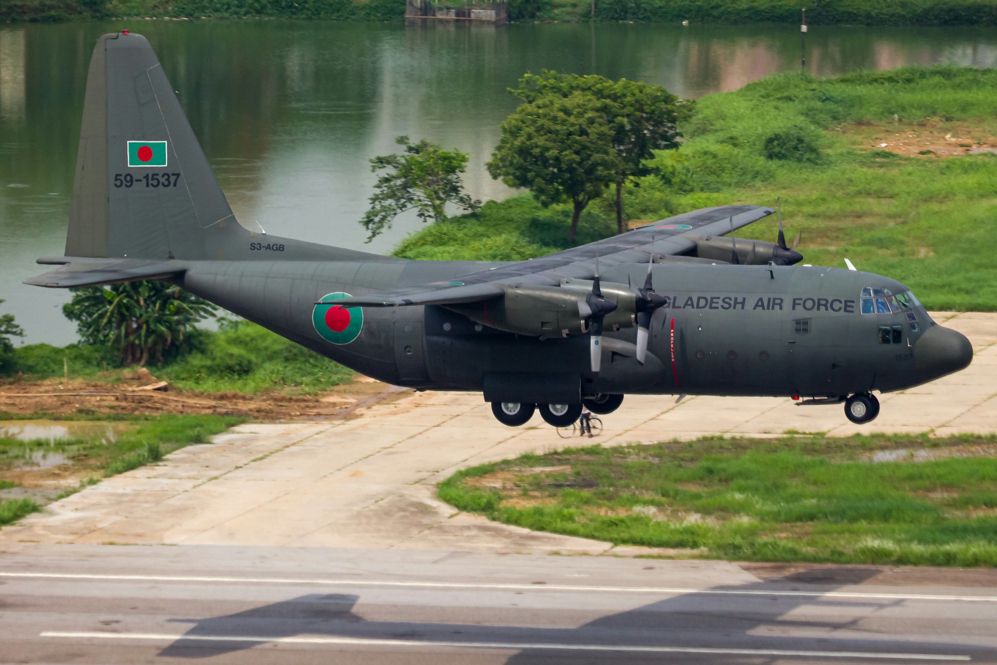 Bangladesh Air Force C-130 in motion over a runway