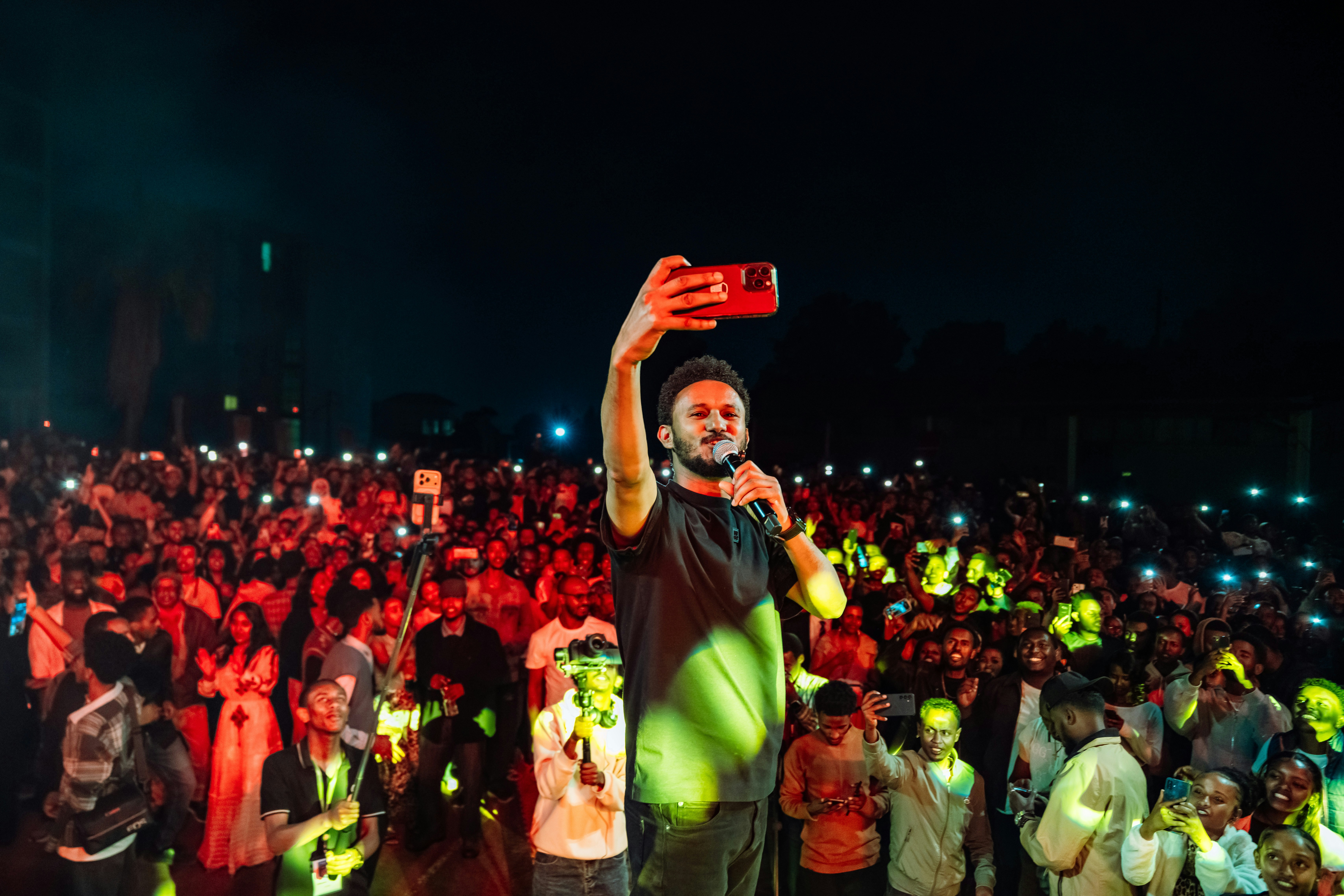 Plugging In: A Spotlighted Lead Surrounded by a Sea of Voices