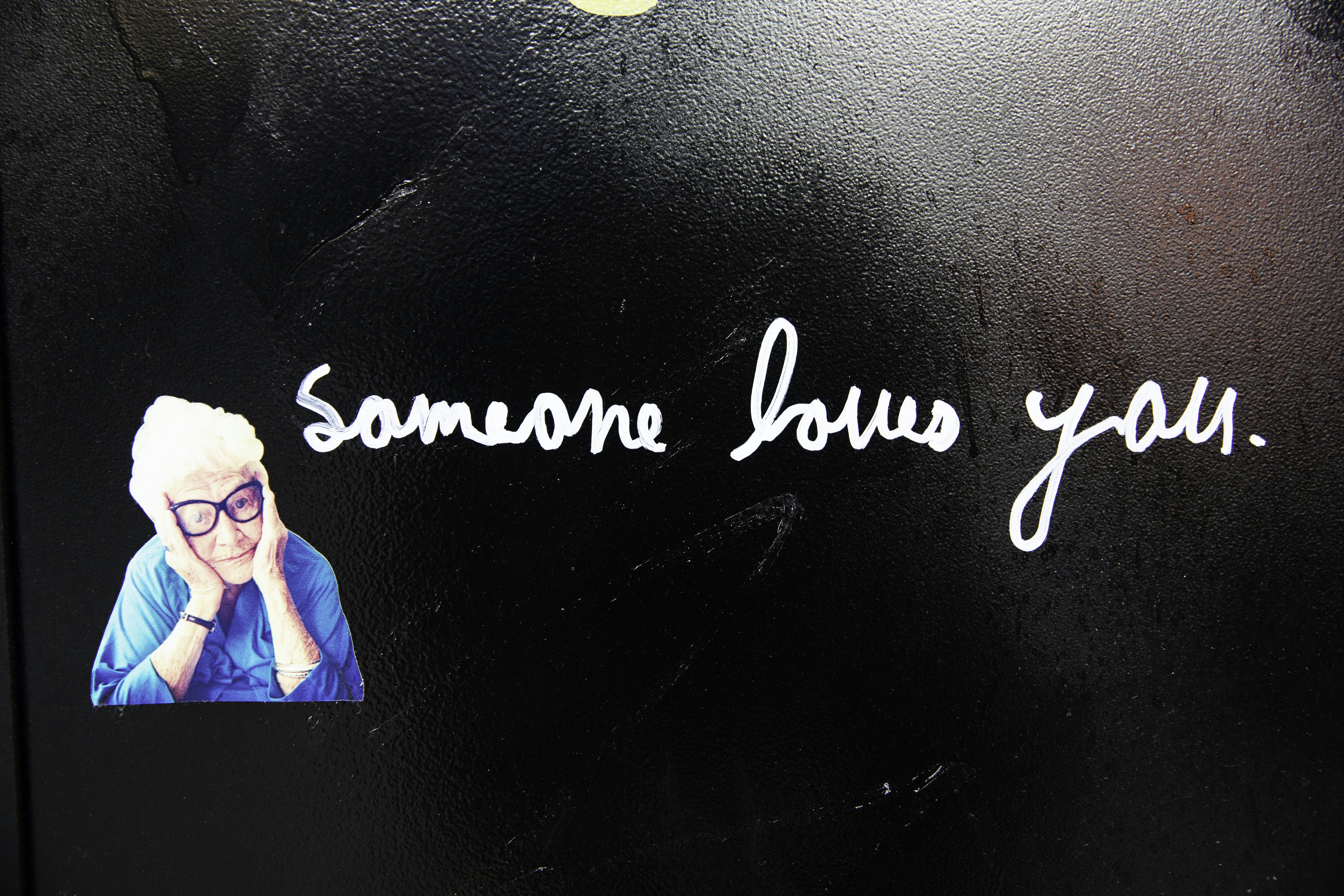 Somewhere Loves You: Graffiti Portrait beneath a Whispered Message