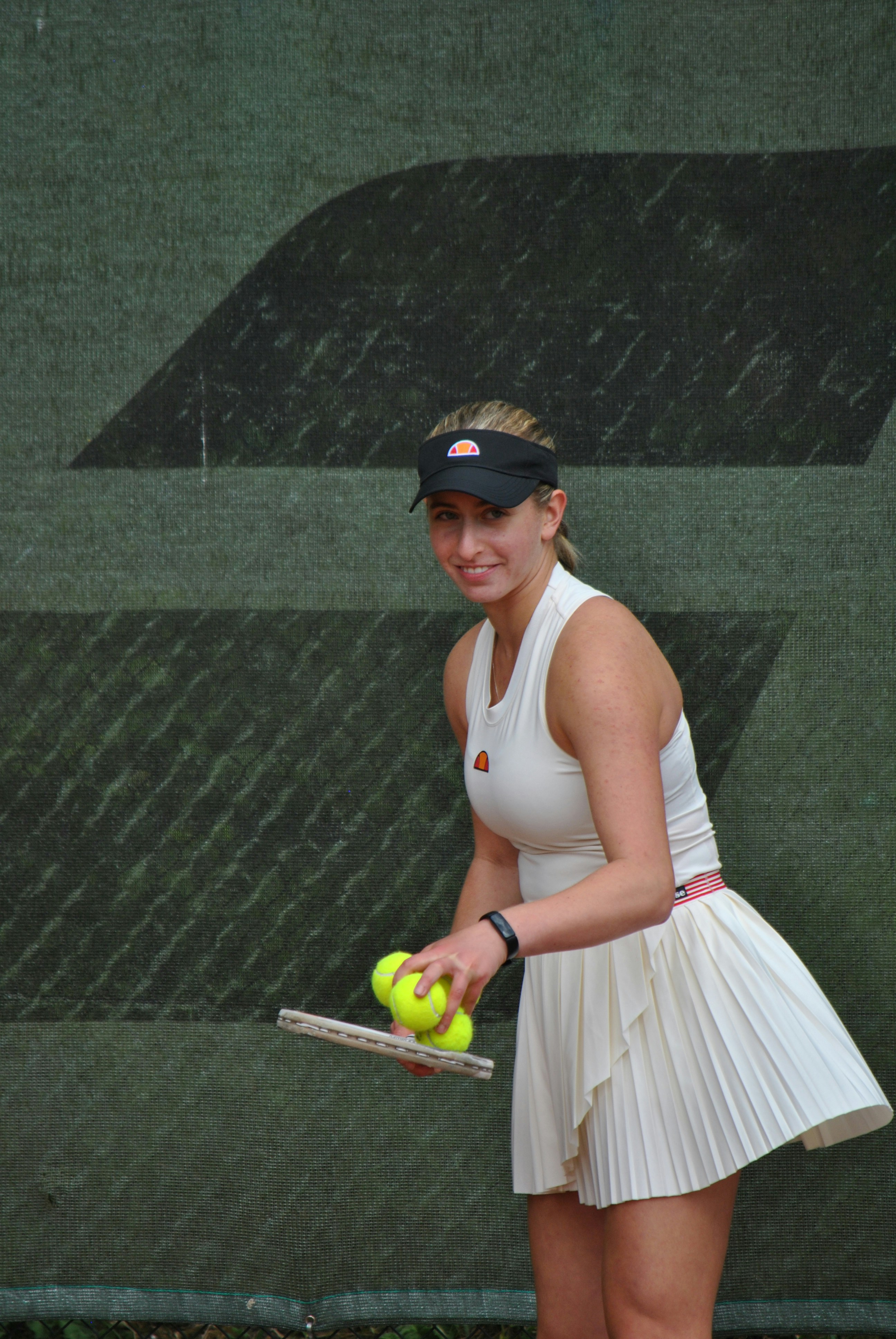Focused Rally: A Tennis Pro paused mid-serve under rain