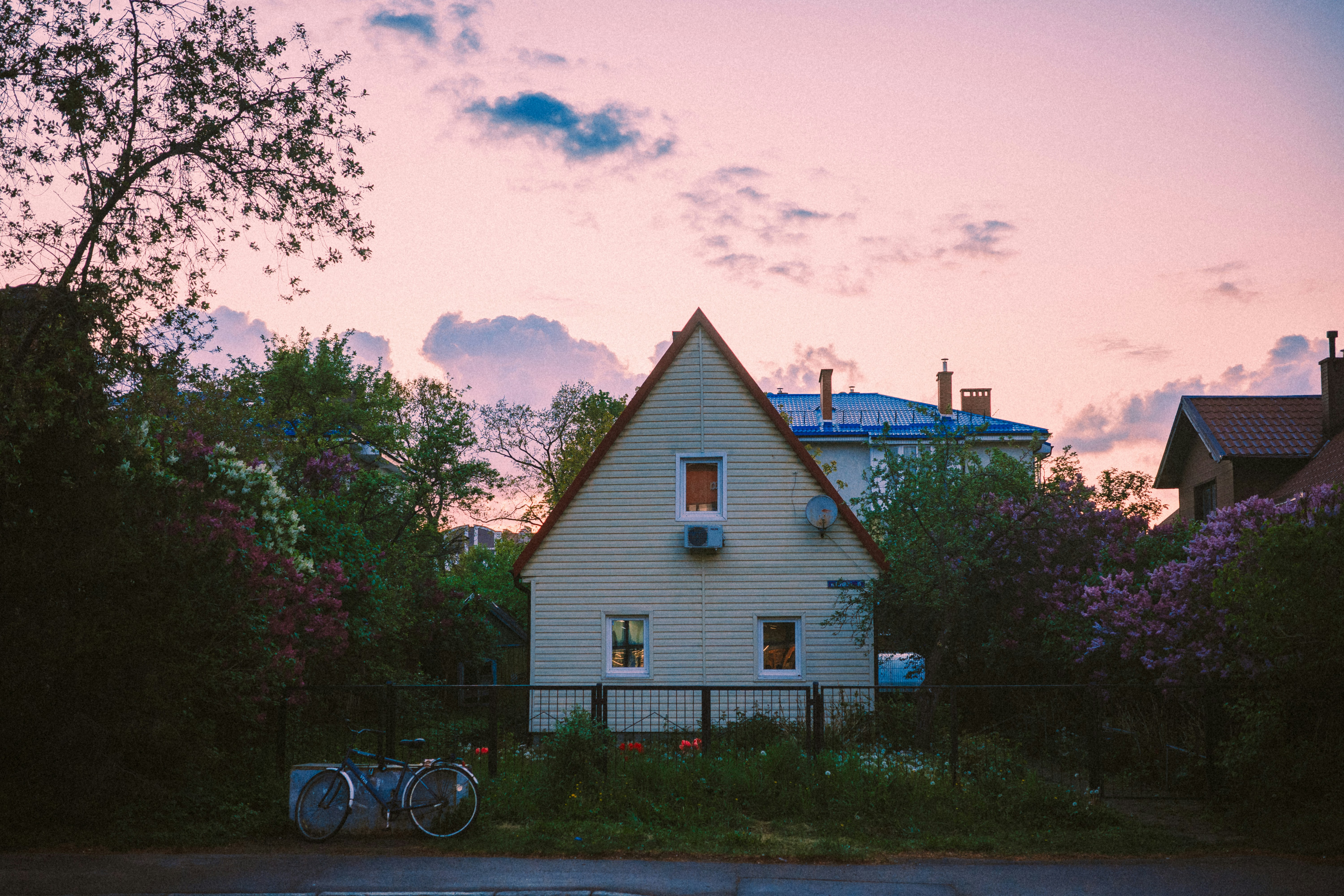 A Quiet Suburban Sunset Beside a Painted A-frame House