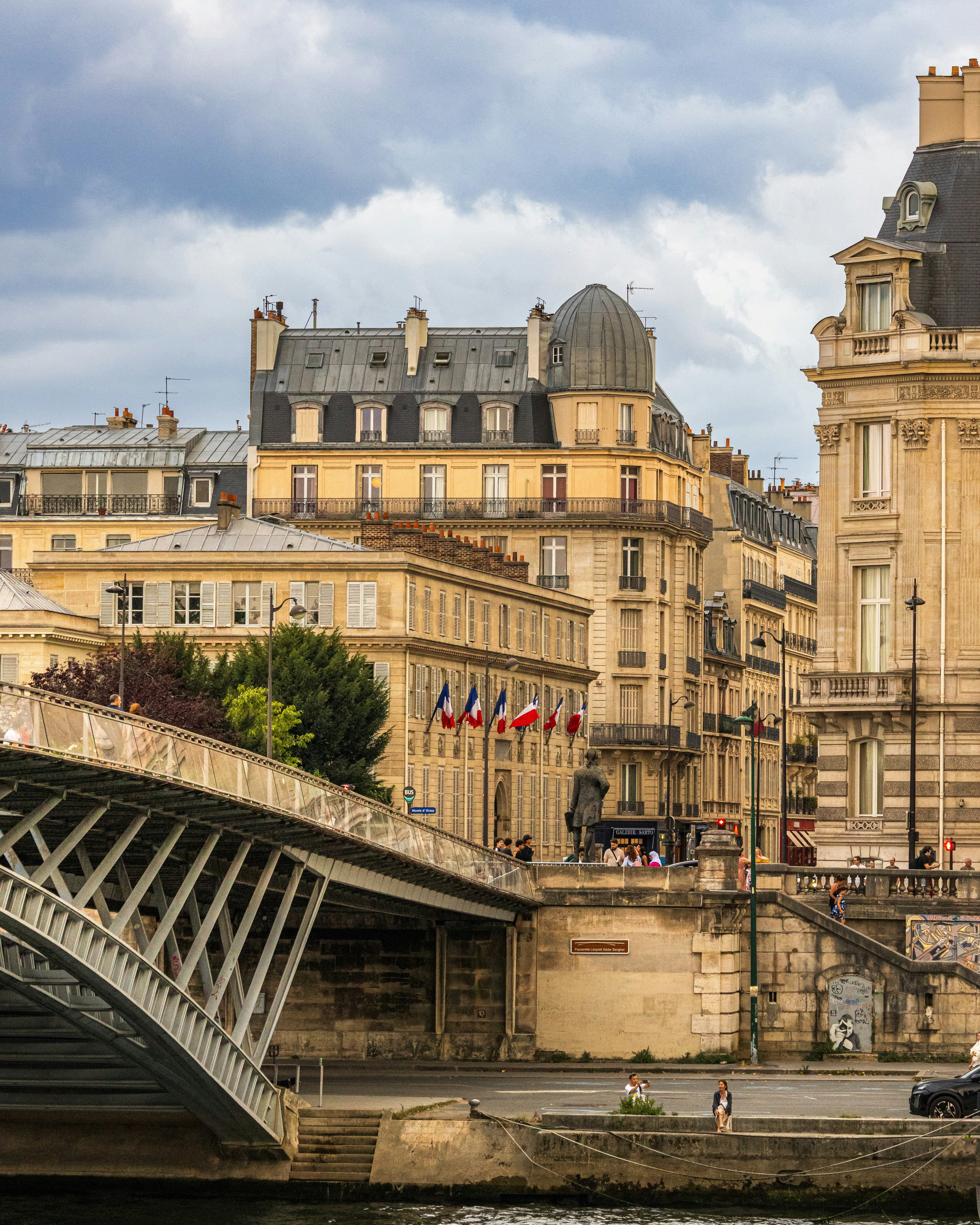 Paris by the Seine: Flags, Facades, and the Curve of the Pont