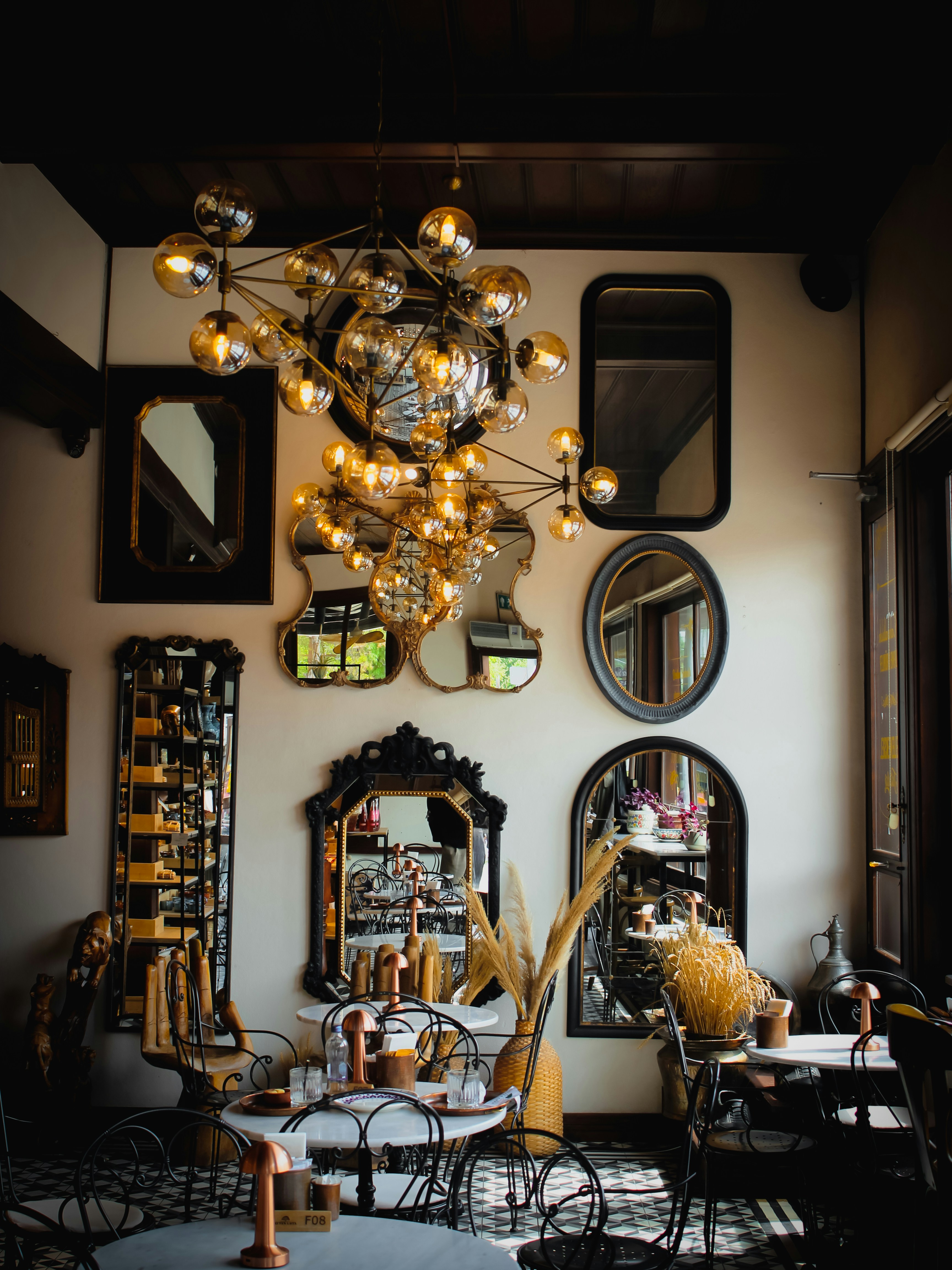 Chandelier Gallery: A Cozy Interior Portrait of Mirrors and Marble-Eye Lighting