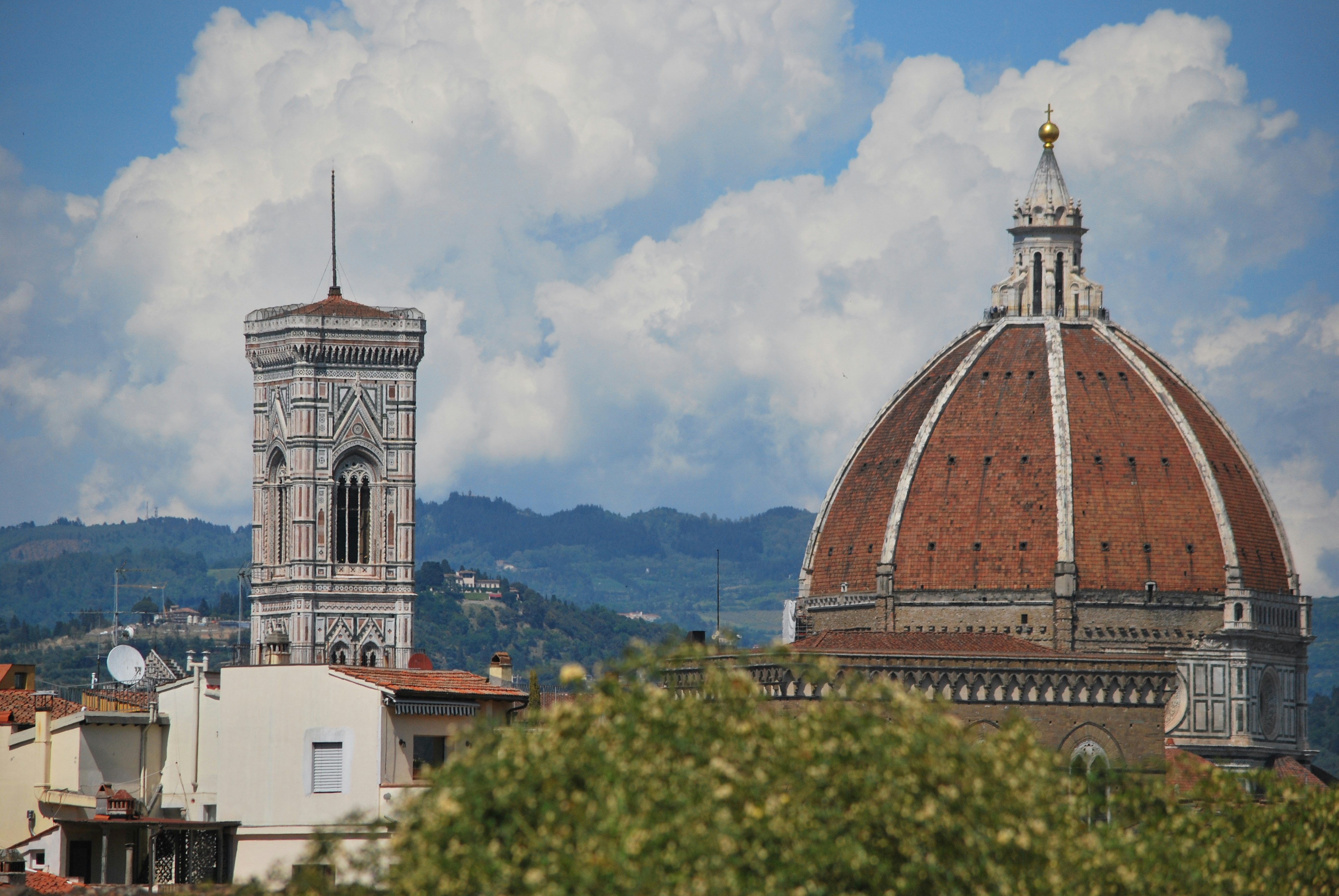 Florentine Hemisphere: Cathedral Dome and Bell Tower Over a Rooftop Townscape