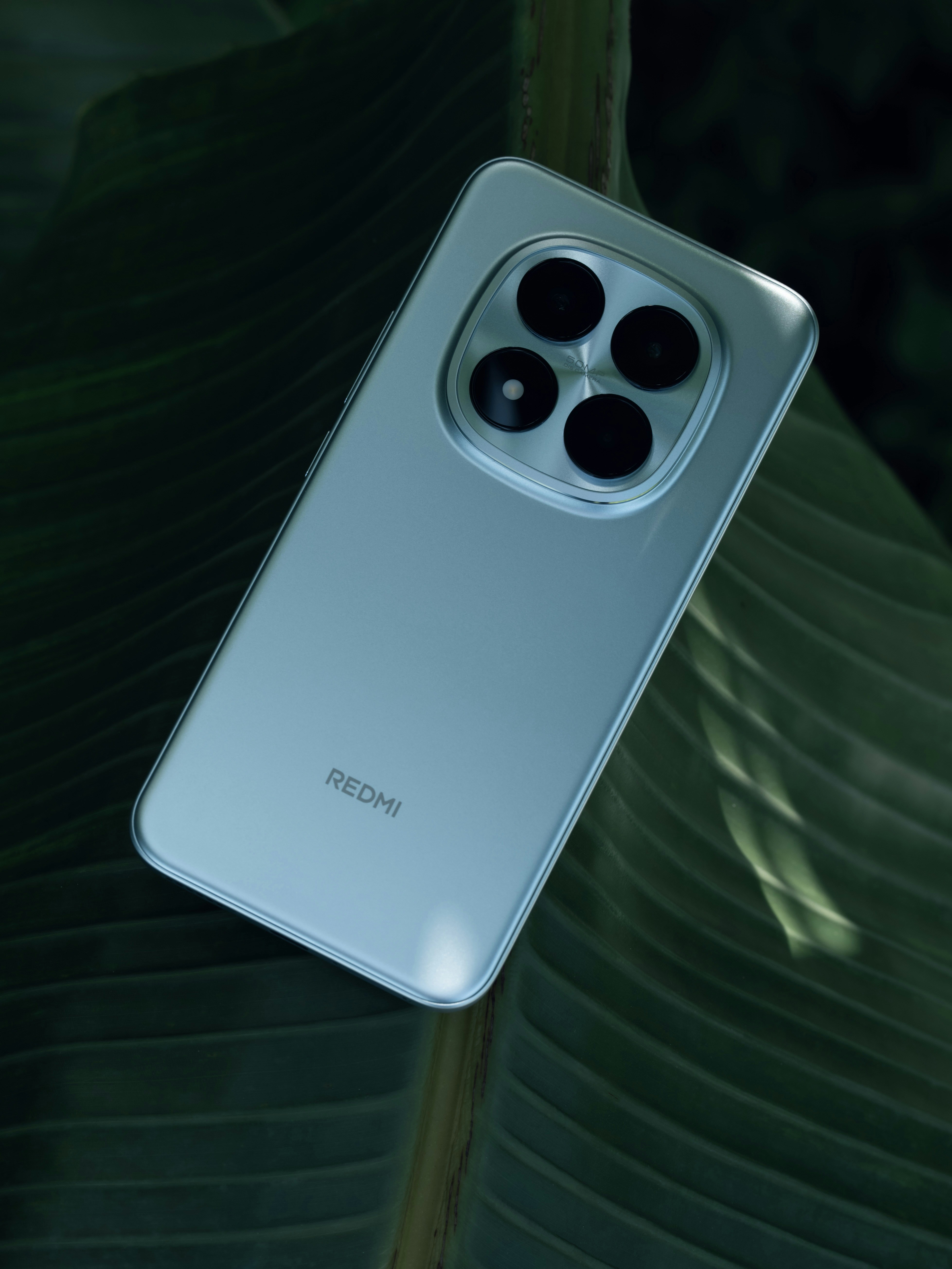 Minty Tech: The Redmi Square with Quad-Camera Quietly Resting on Foliage